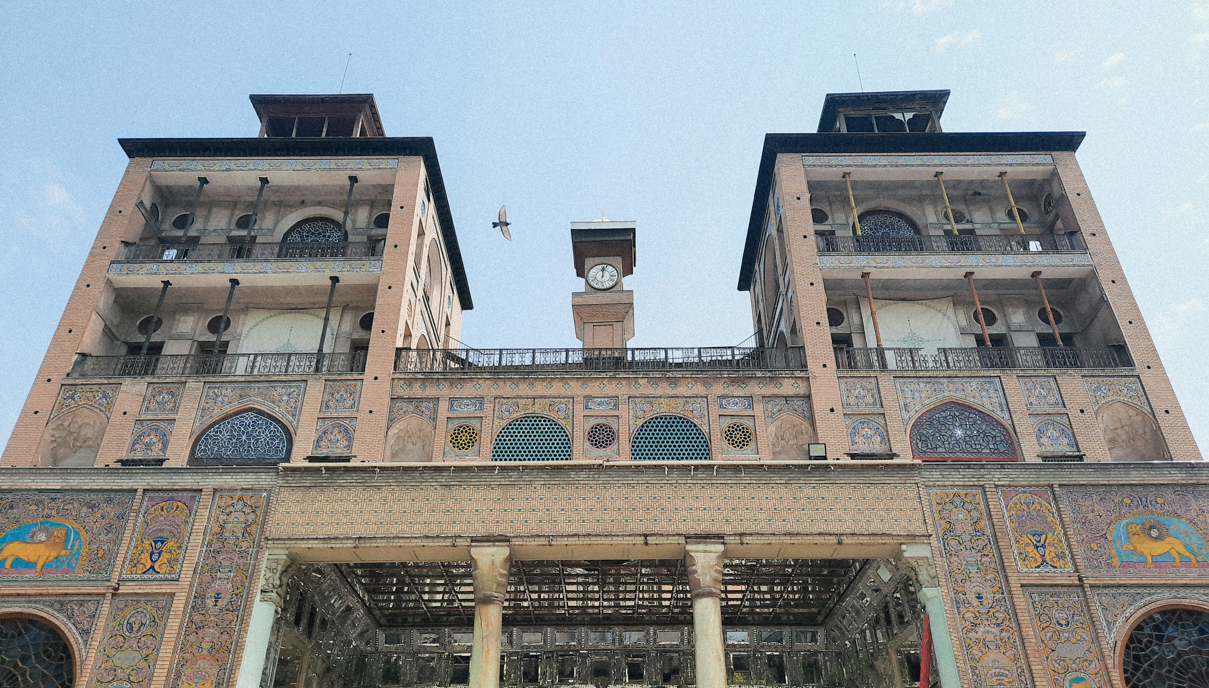 Ornate building with two towers and columns