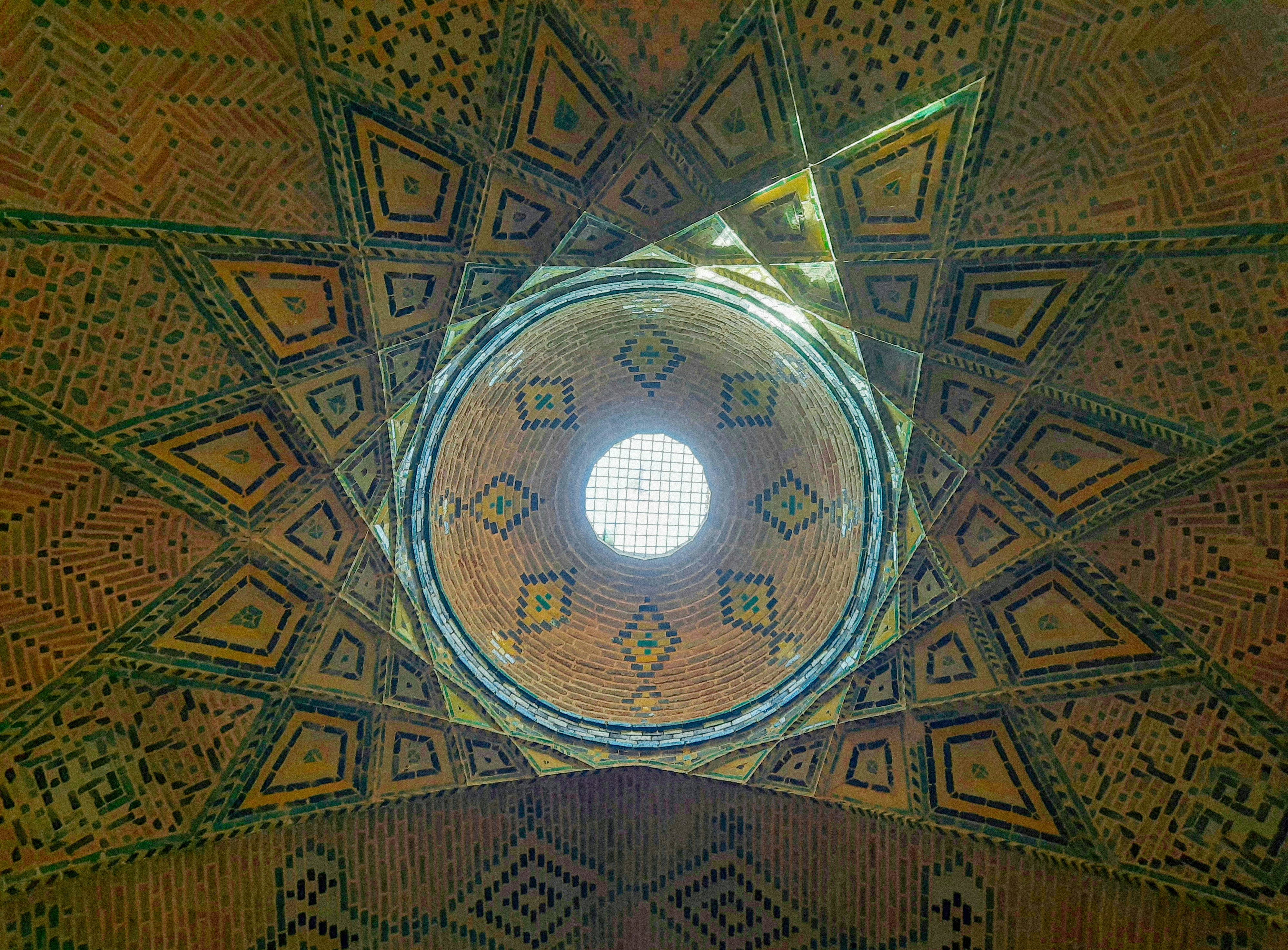 Intricate geometric patterns on a domed ceiling