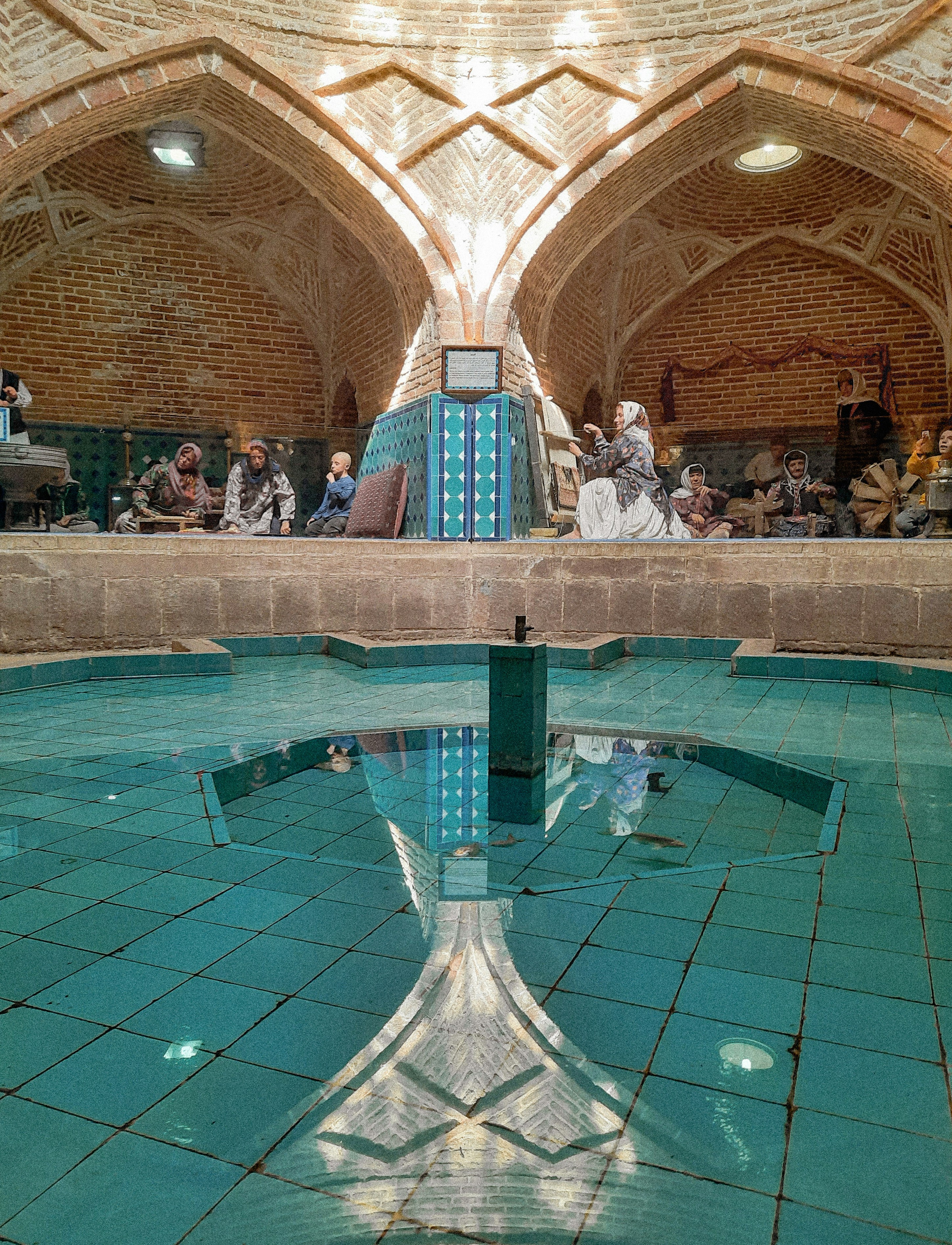 Ornate interior with pool and geometric ceiling