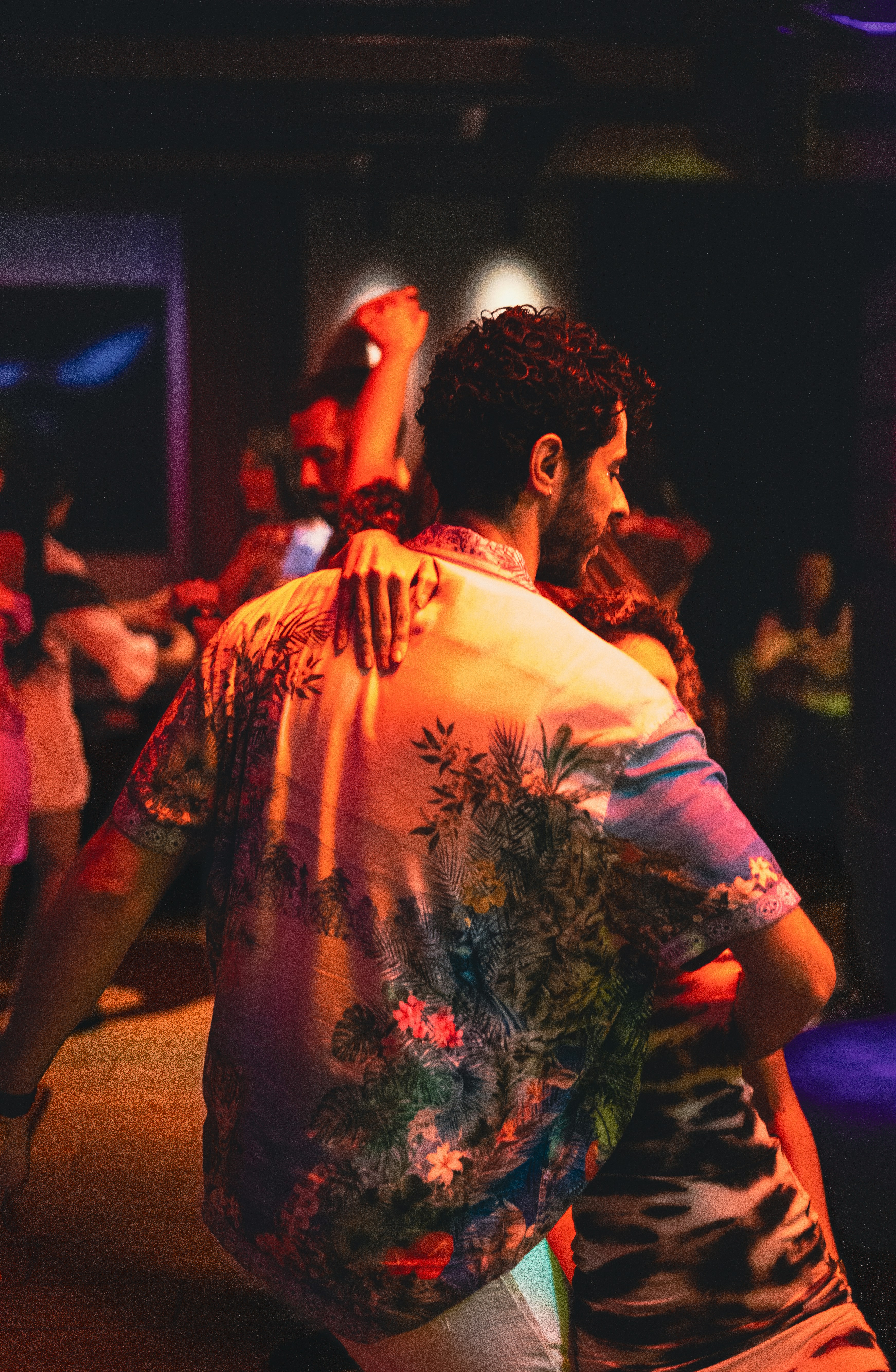 Couple dancing closely in a dimly lit room
