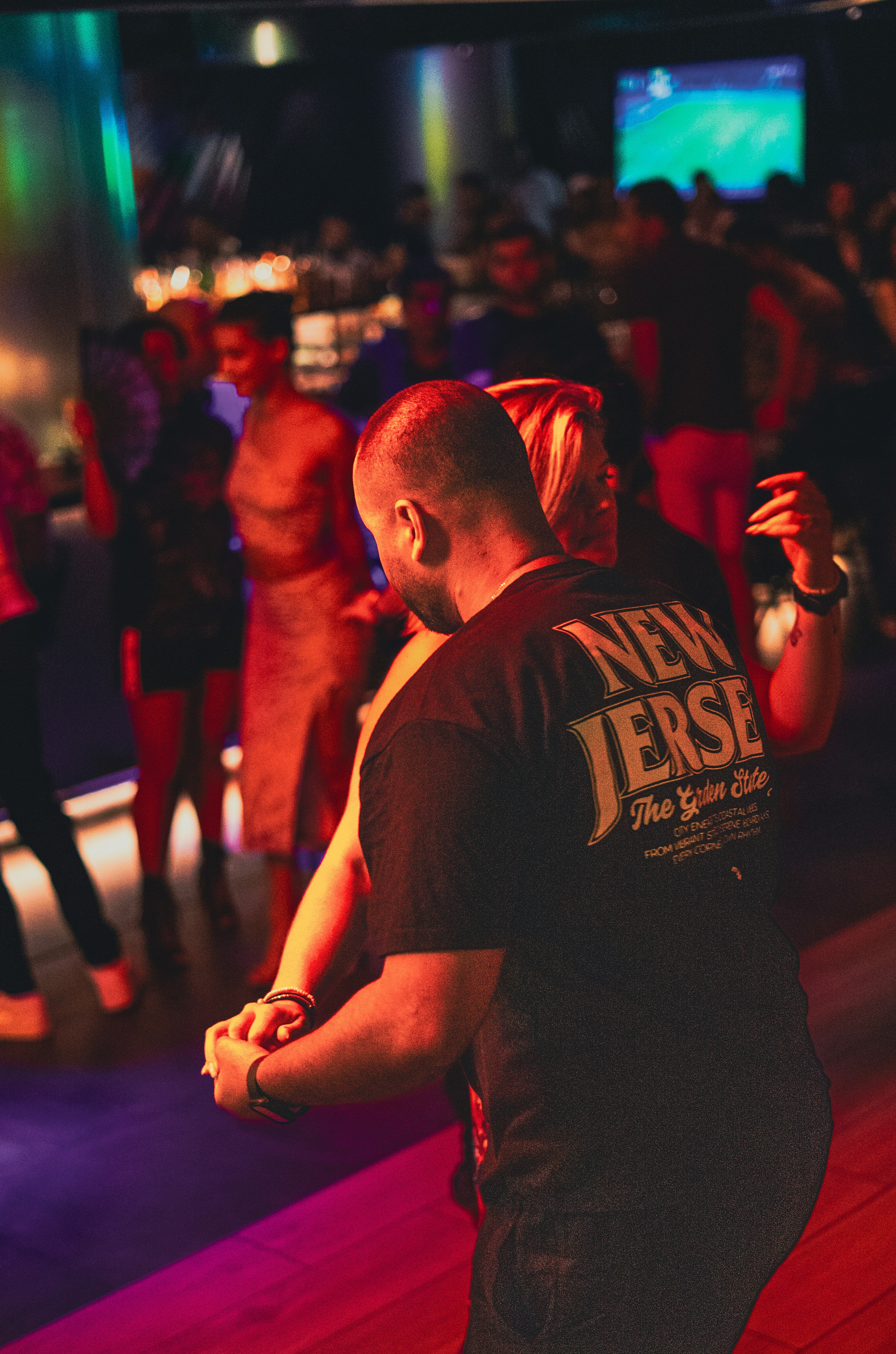 Couple dancing in a dimly lit club