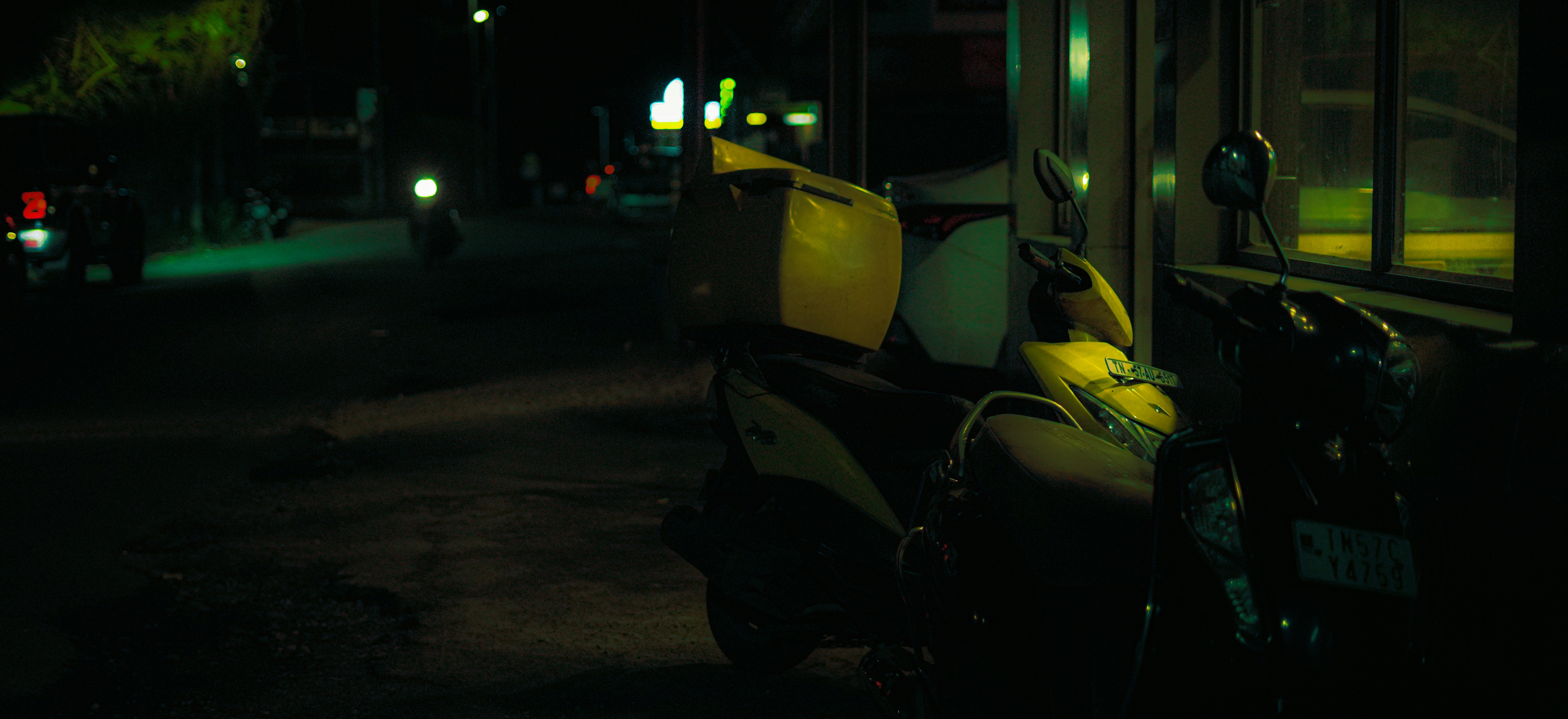 People walking on a city street at night