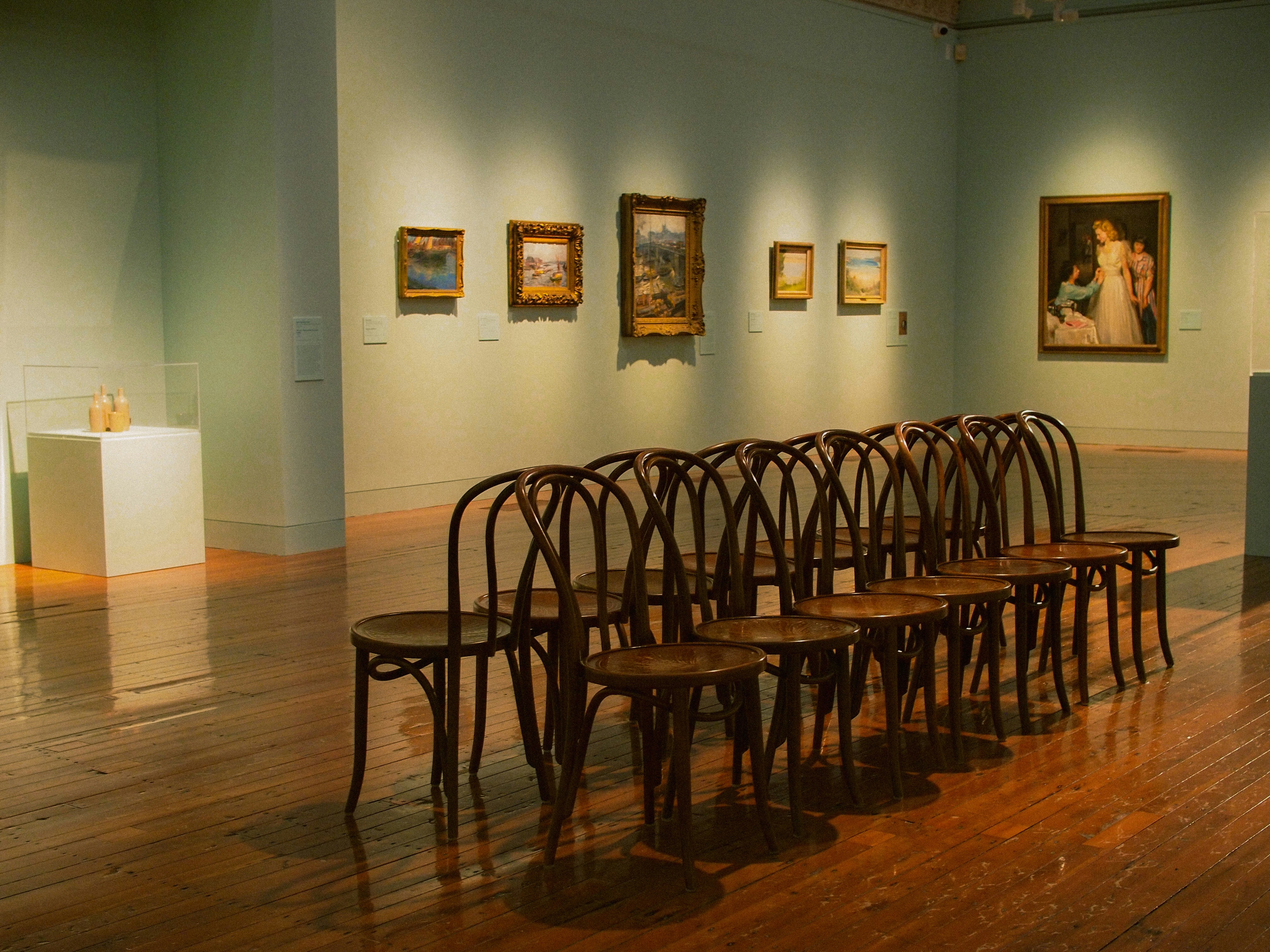 Art gallery with paintings and seating