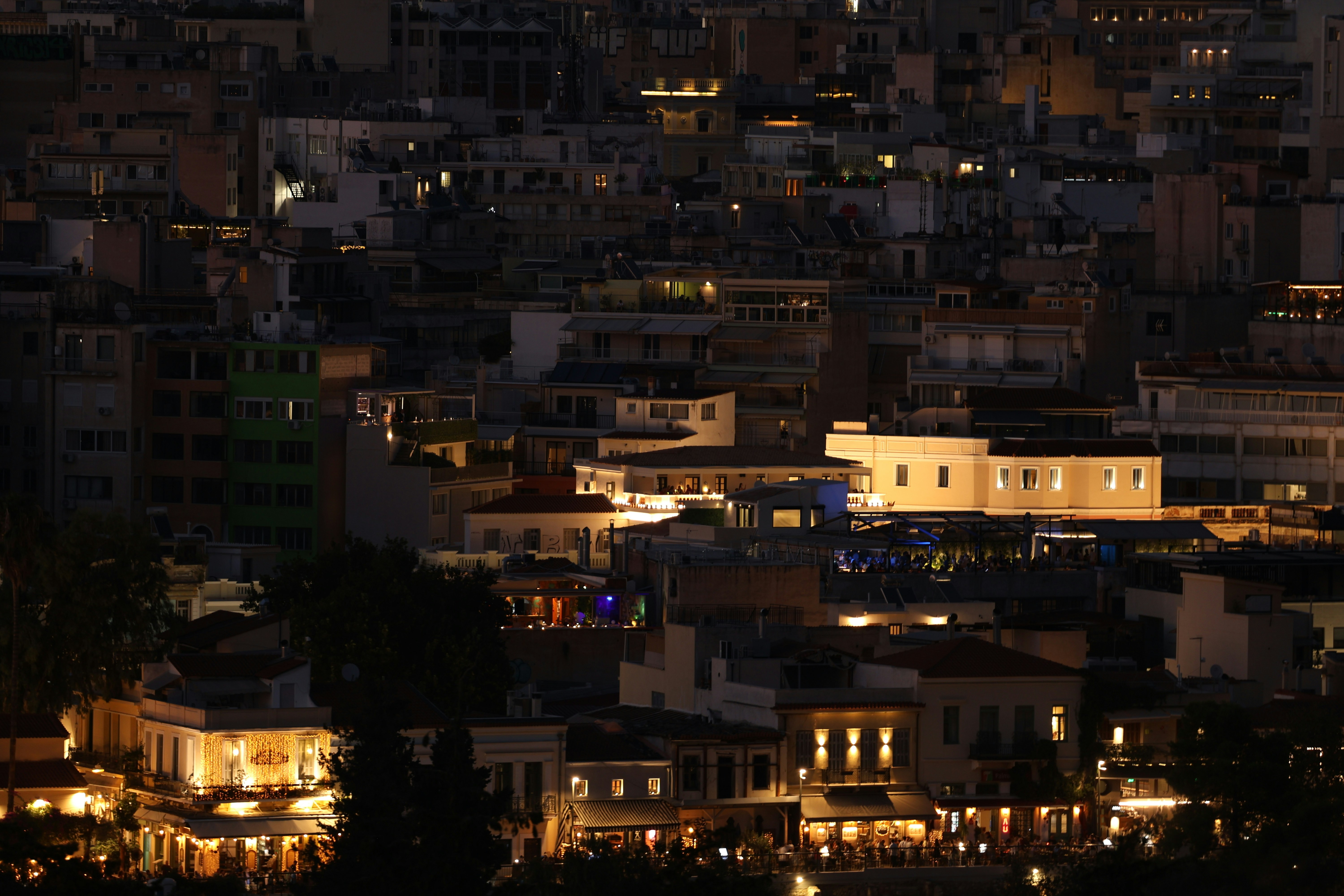 Cityscape with glowing lights at night