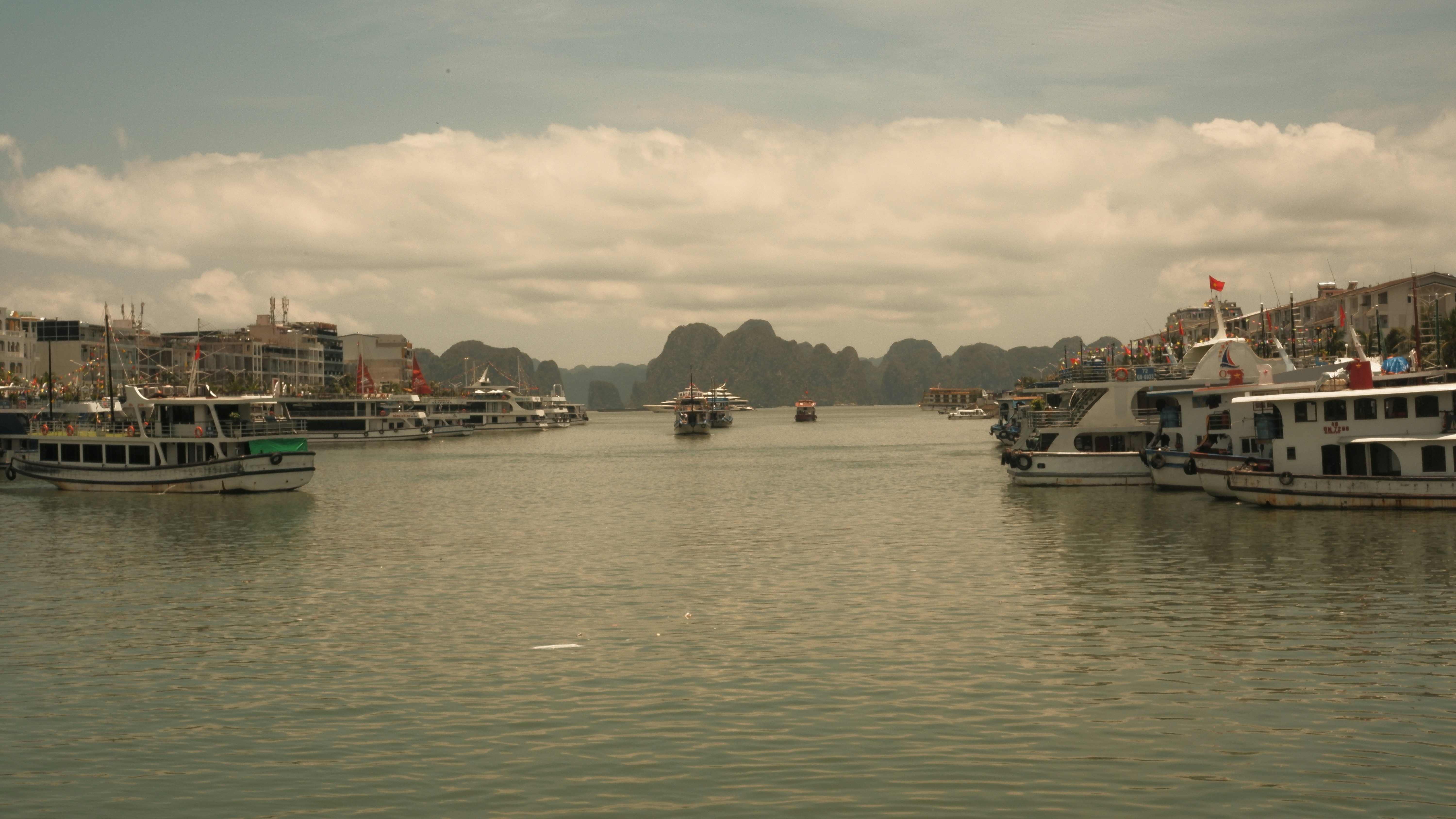 Harbor Harmony: A Dance of Vessels and Mountains