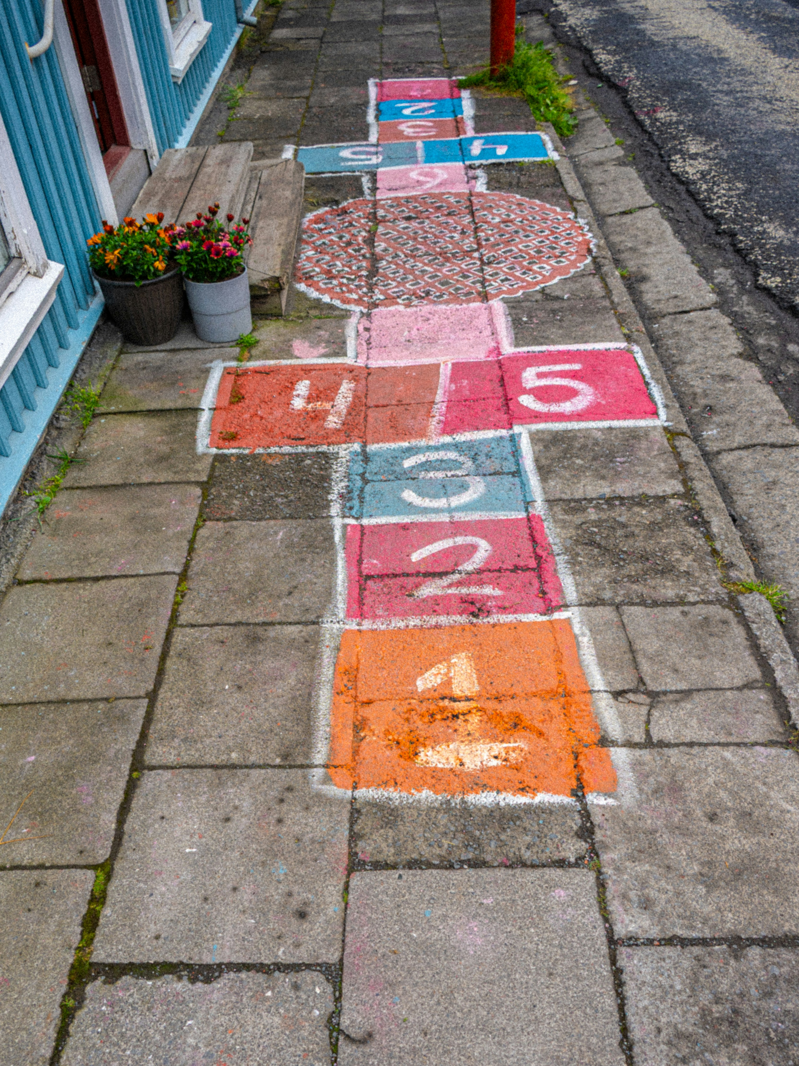 Colorful hopscotch court painted on a sidewalk