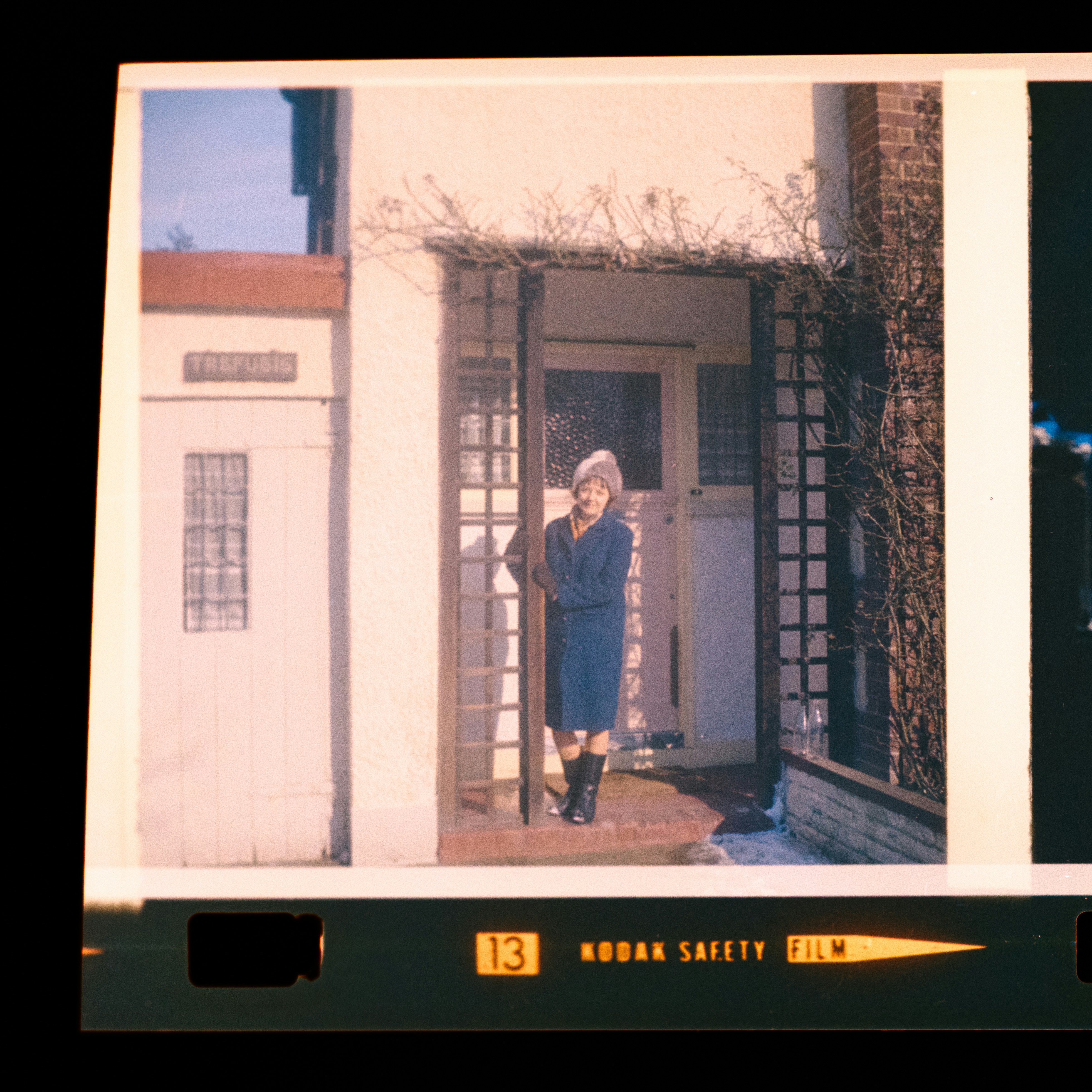 Woman in blue coat stands at doorway photo – Free Woman Image on Unsplash