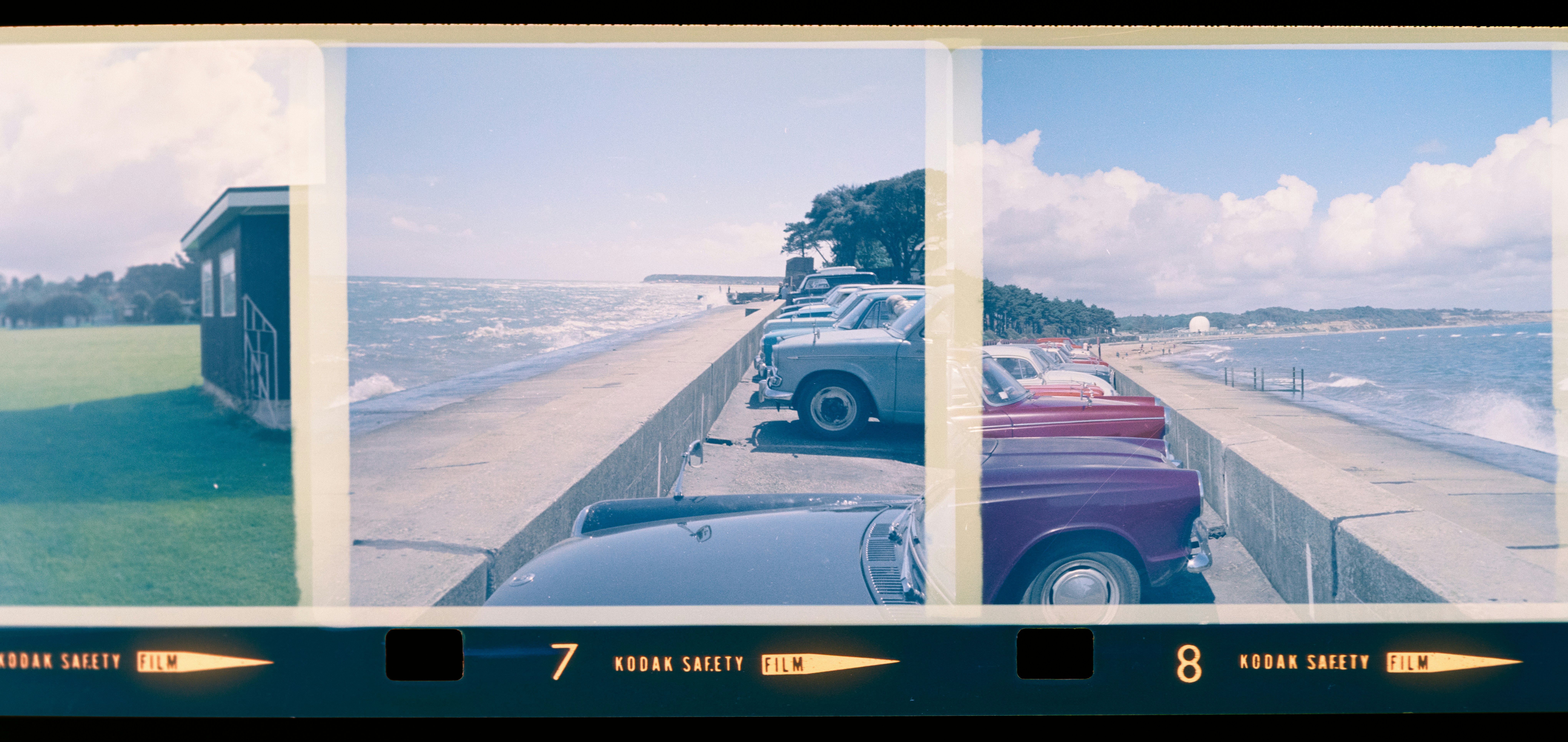 Coastal Parking Lane: A Triptych of Sea, Sky, and Chrome