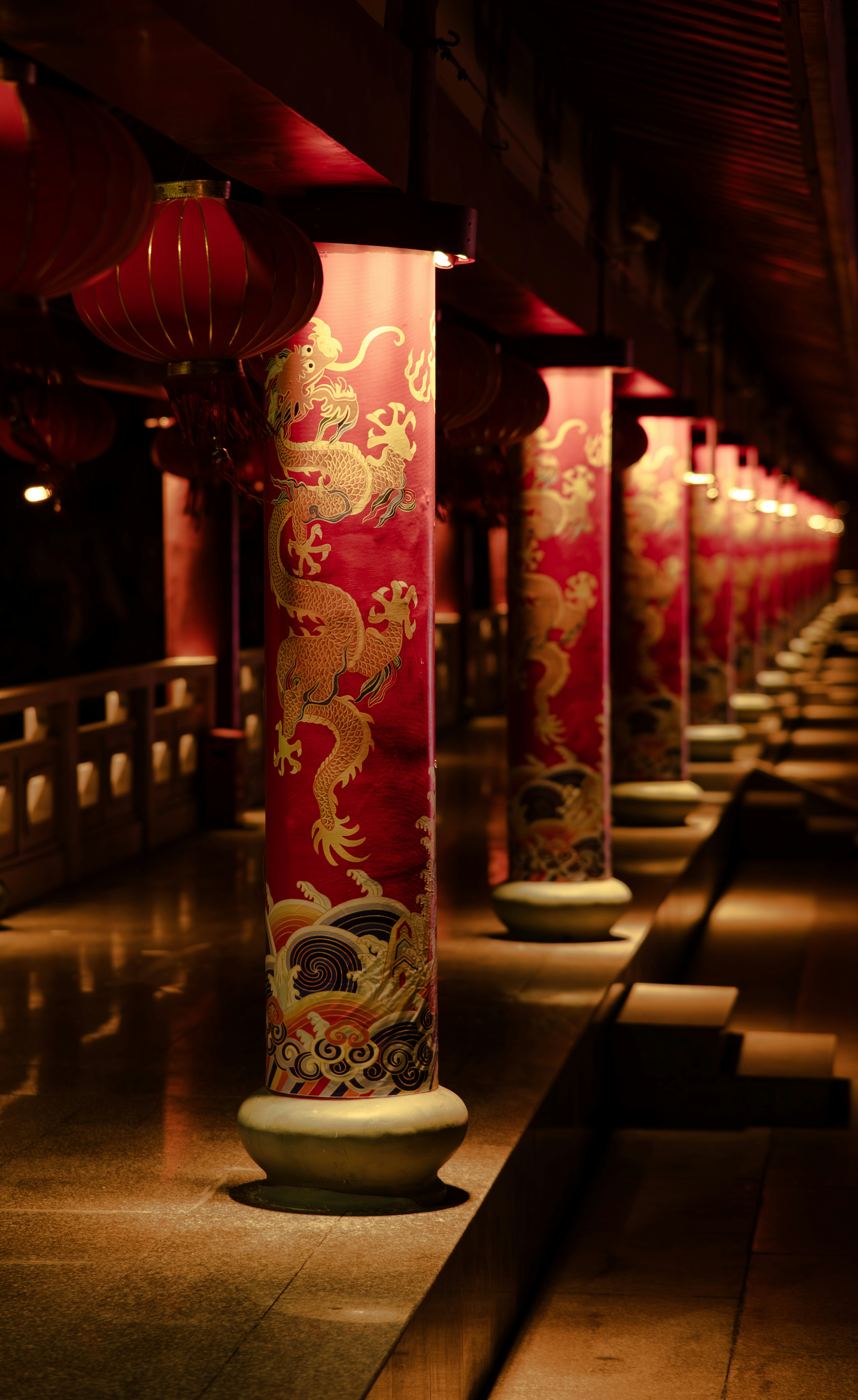 Crimson Lantern Colonnade: Dragon-Decorated Pillars in a Night Corridor