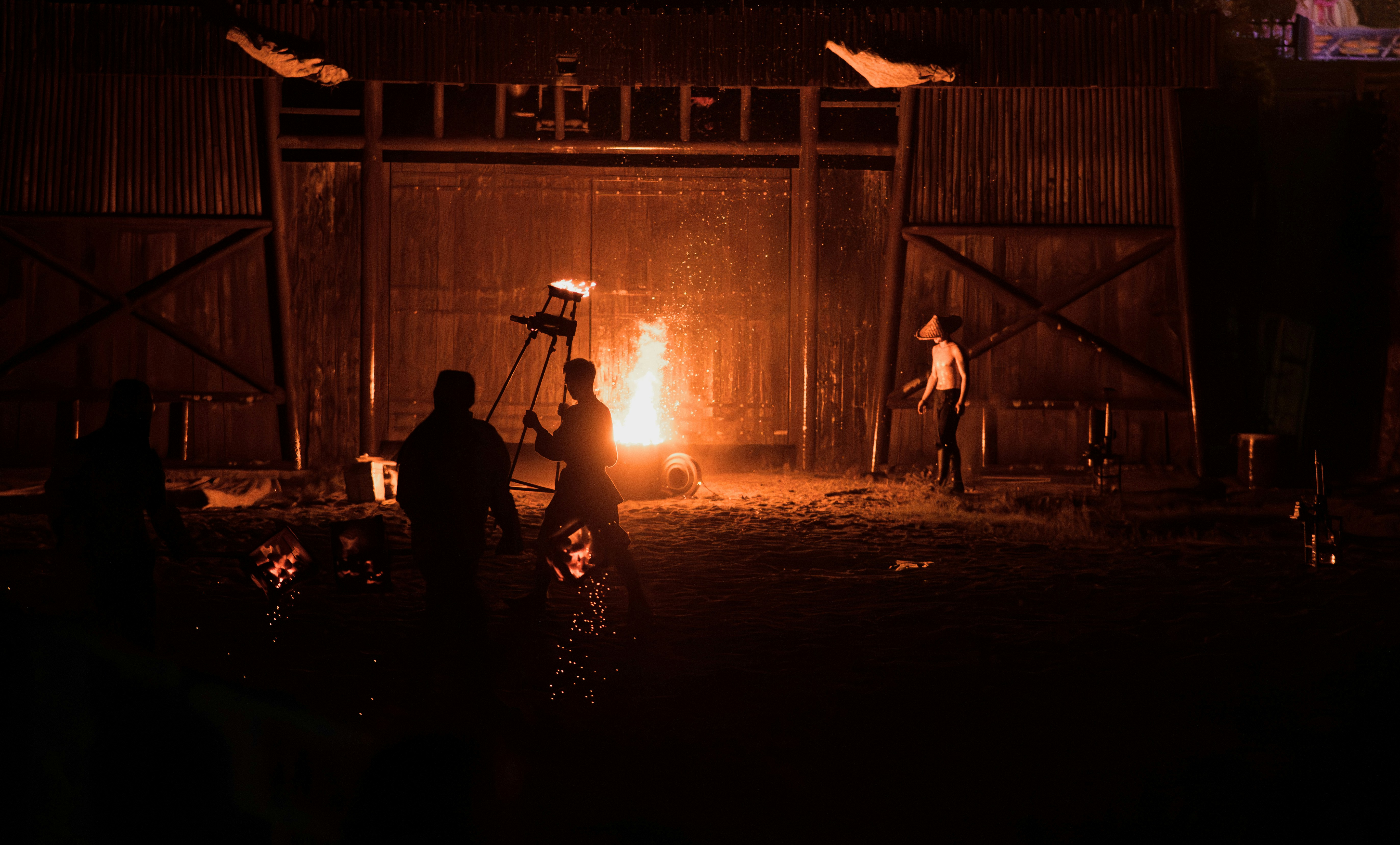 Forge at Dusk: Firelight Behind the Doors