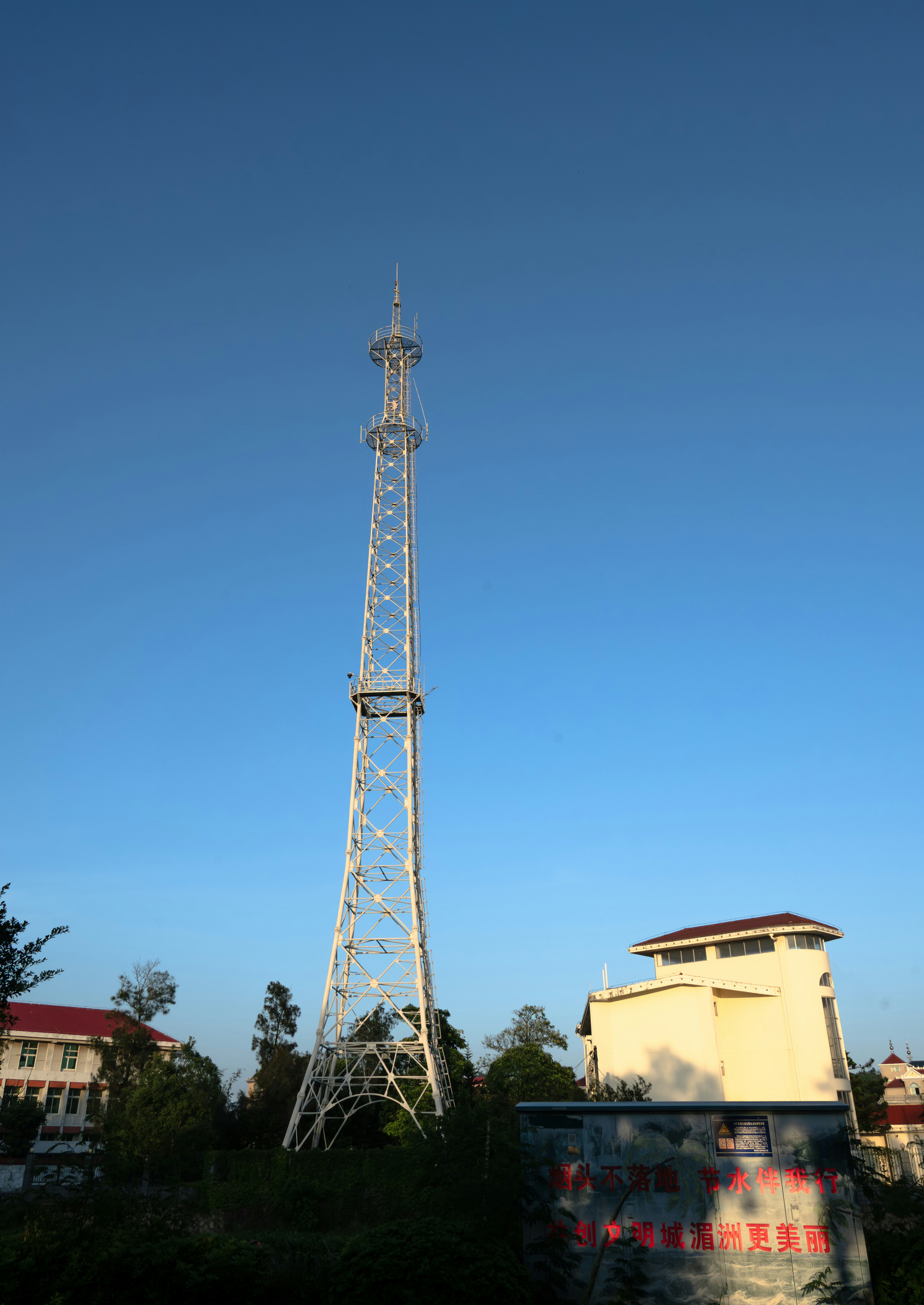 Tall white tower against a clear blue sky
