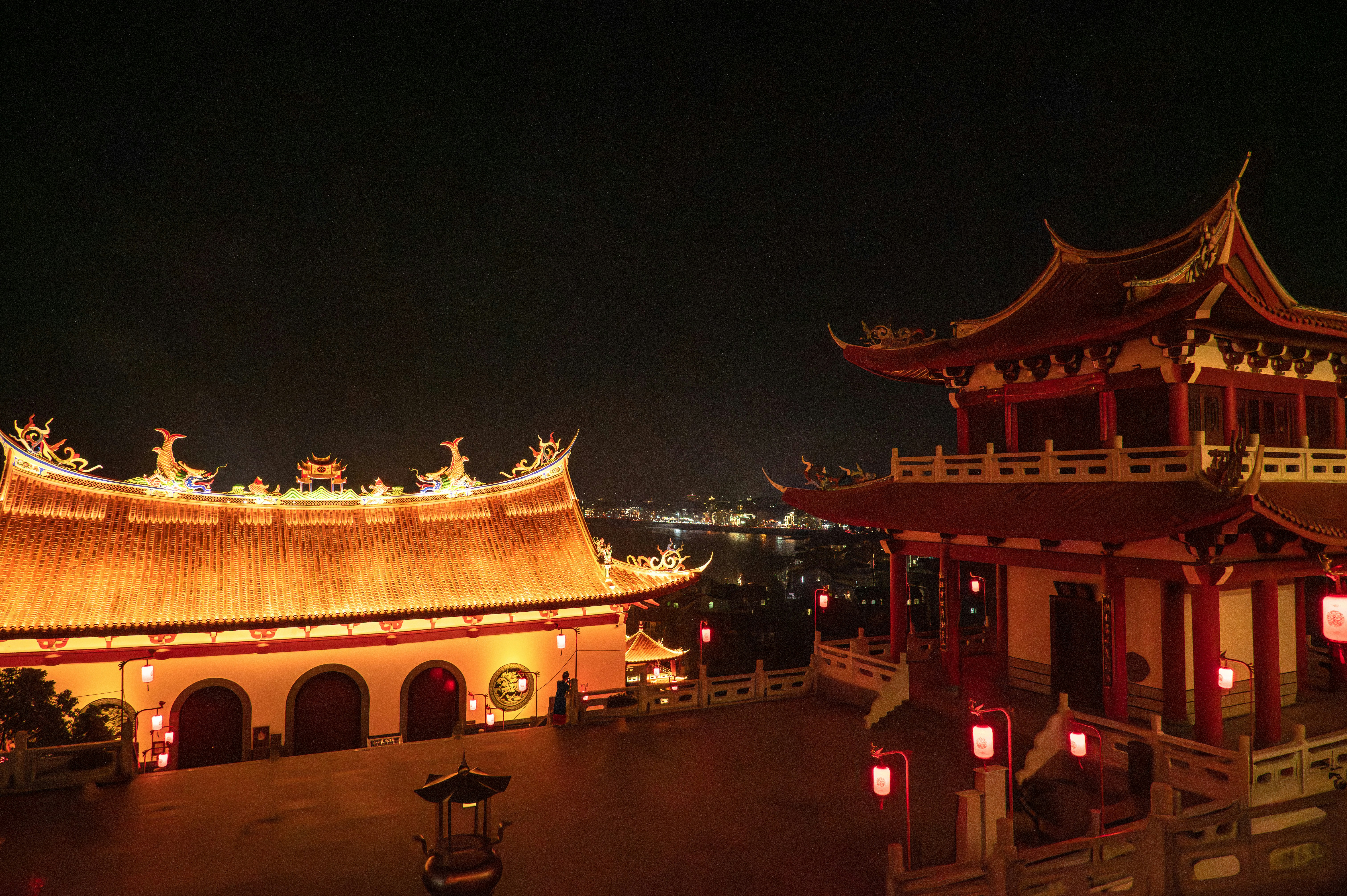 Traditional illuminated asian buildings at night.