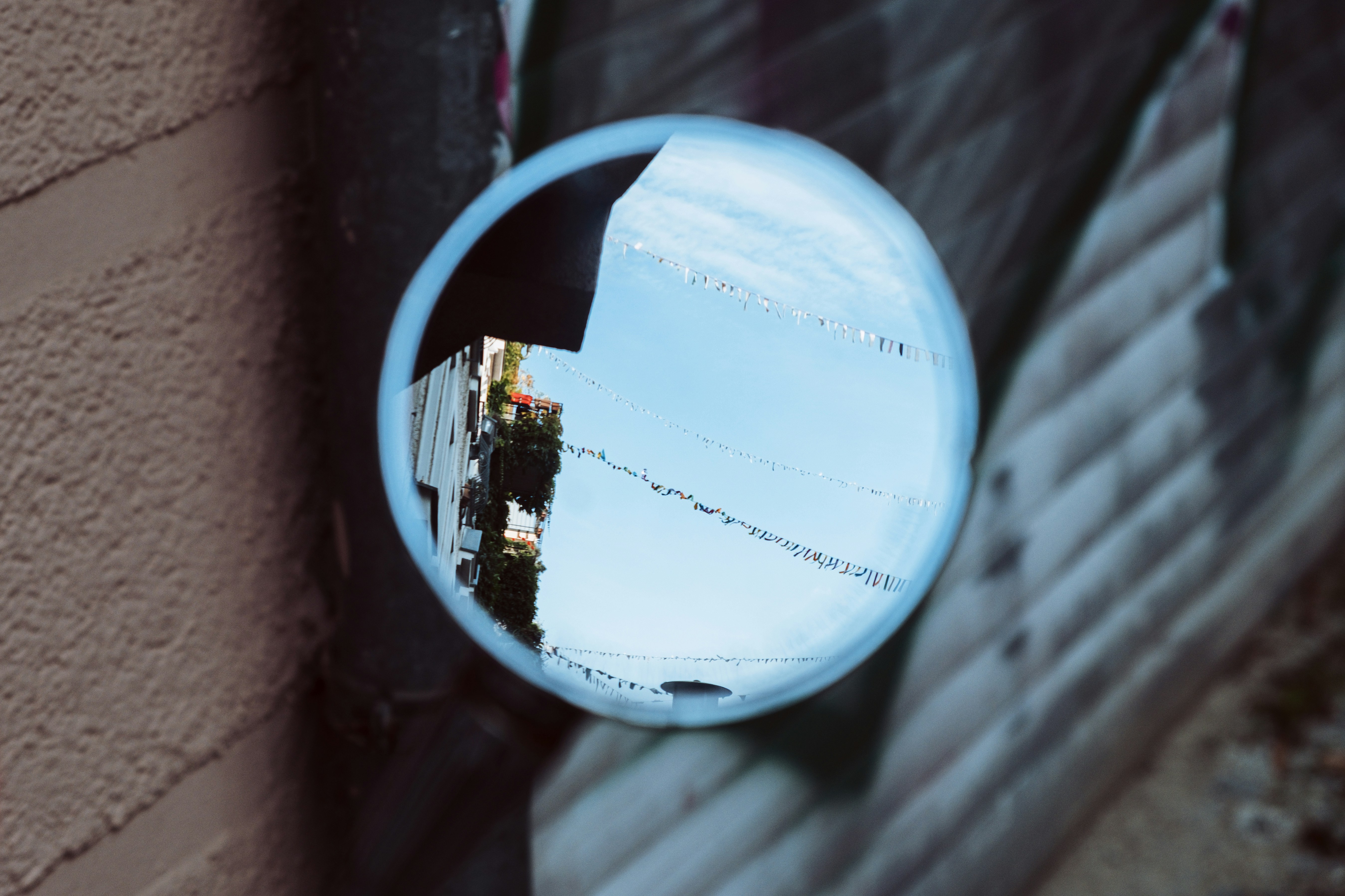 Reflection in a convex mirror on a brick wall