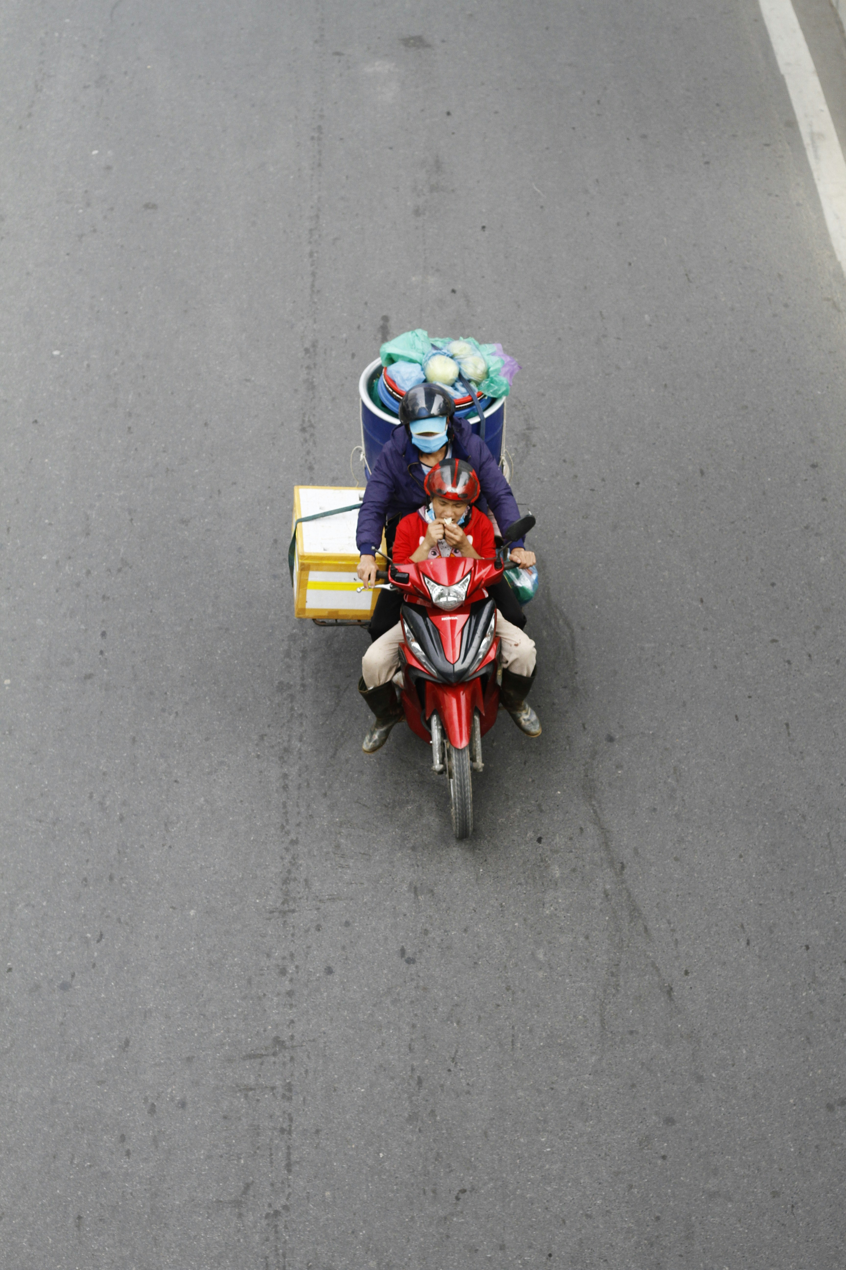 Motorbike in Hanoi, Vietnam | Motorcyclist with large cargo on a street