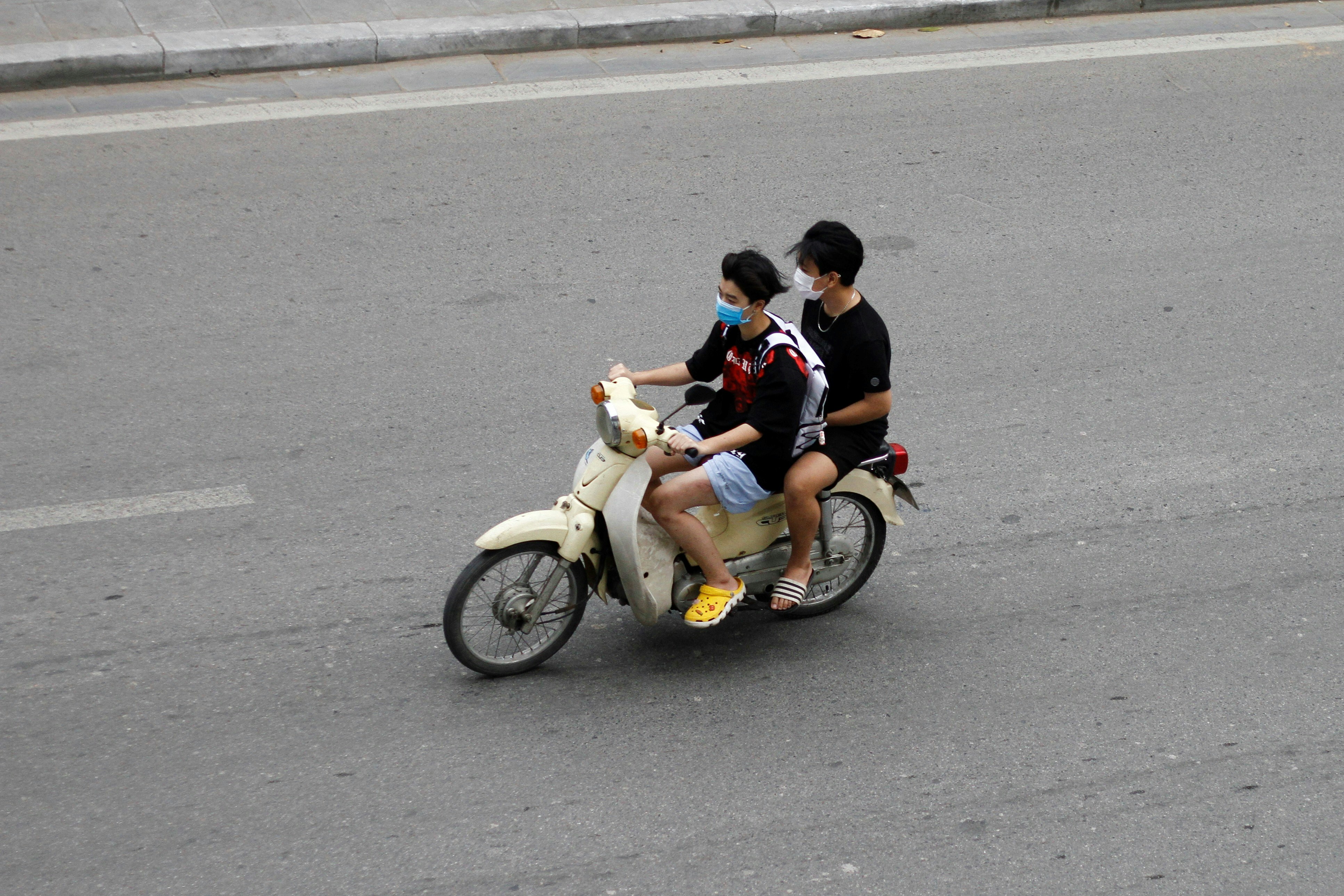 Urban Duo on Wheels: A Snapshot of Everyday Life