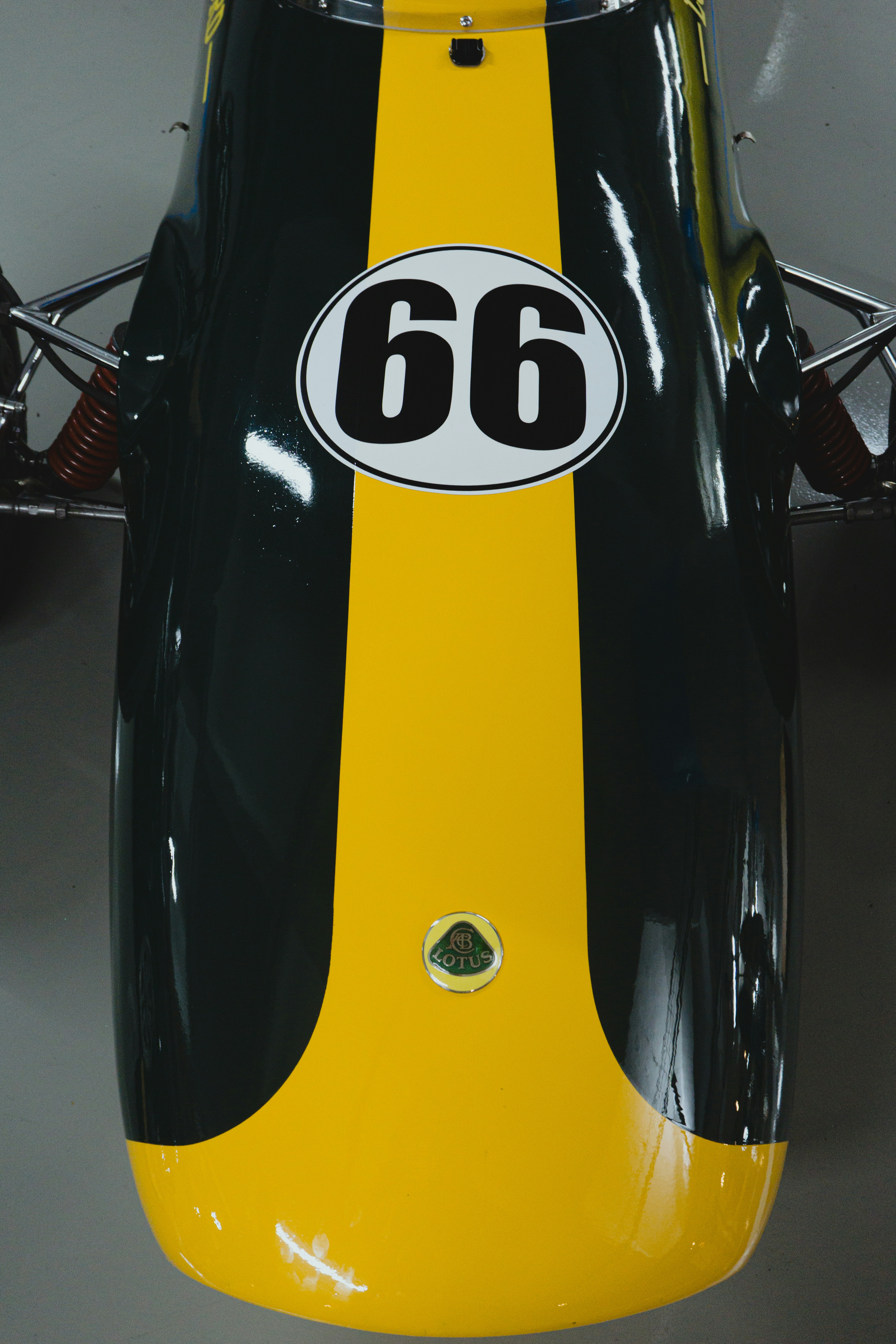 A vintage race car with number 66