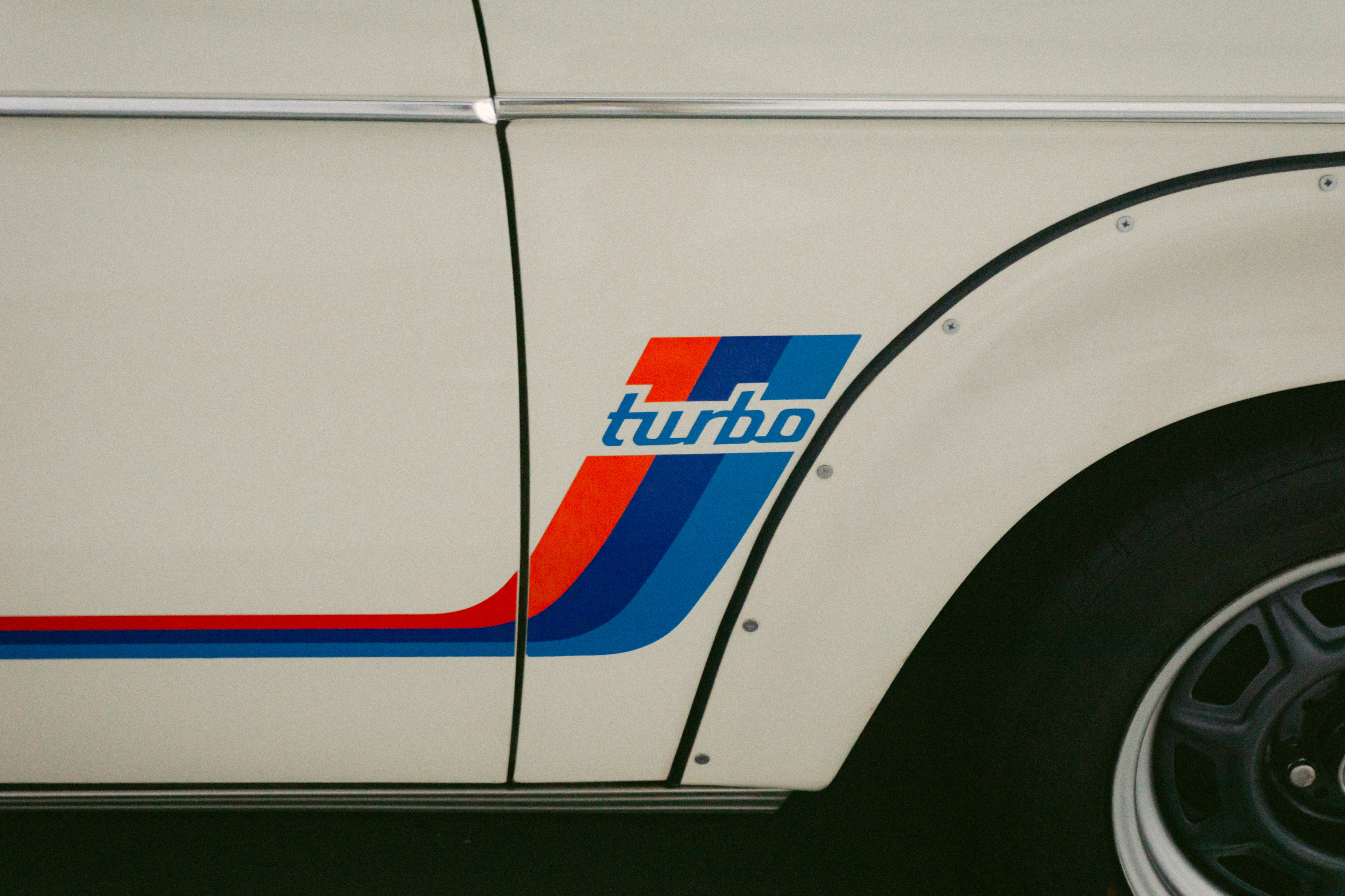 White car with turbo stripe detail