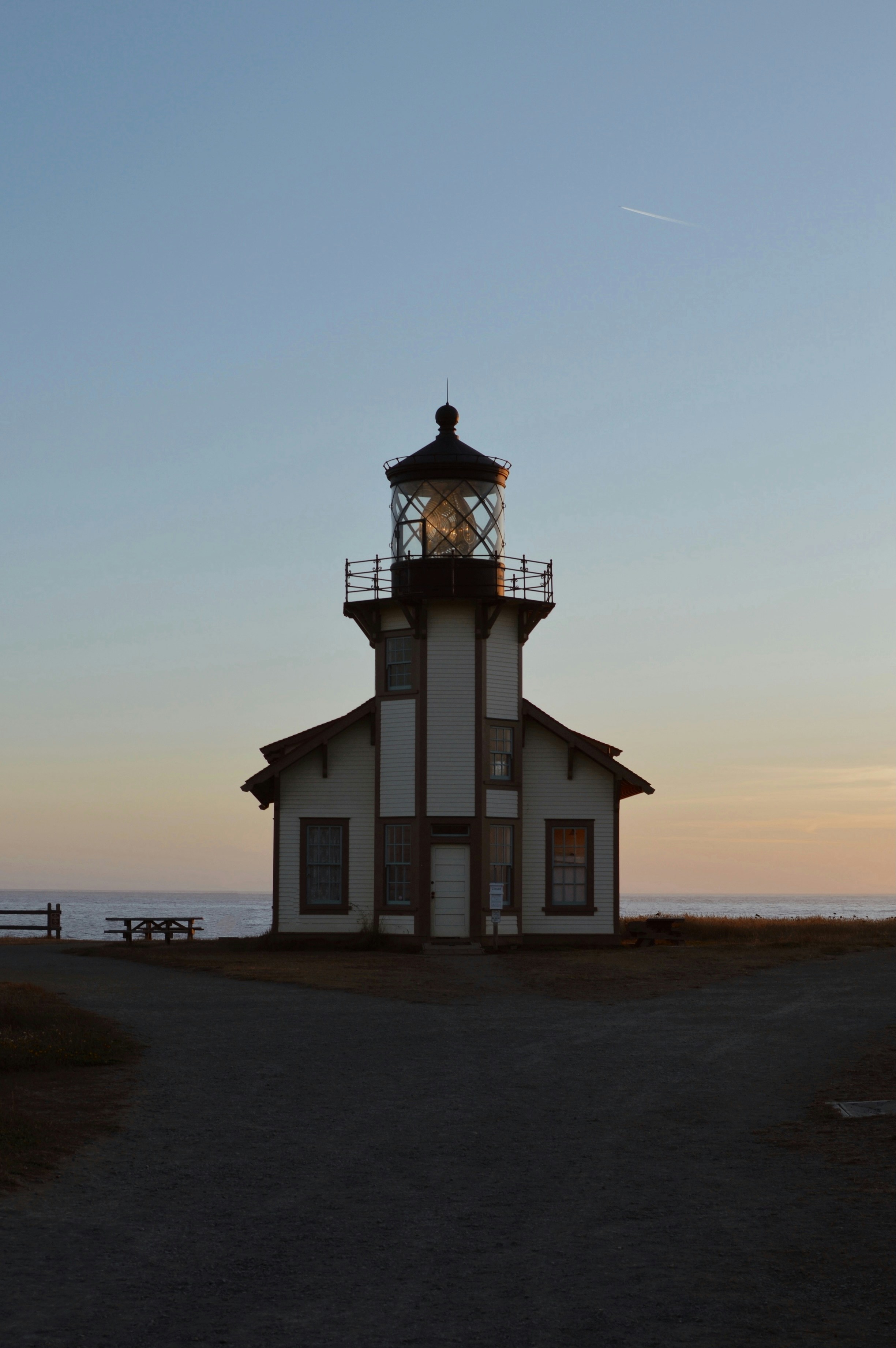 Point Cabrillo lighthouse in Mendocino California | Lighthouse on a cliff overlooking the ocean at dusk
