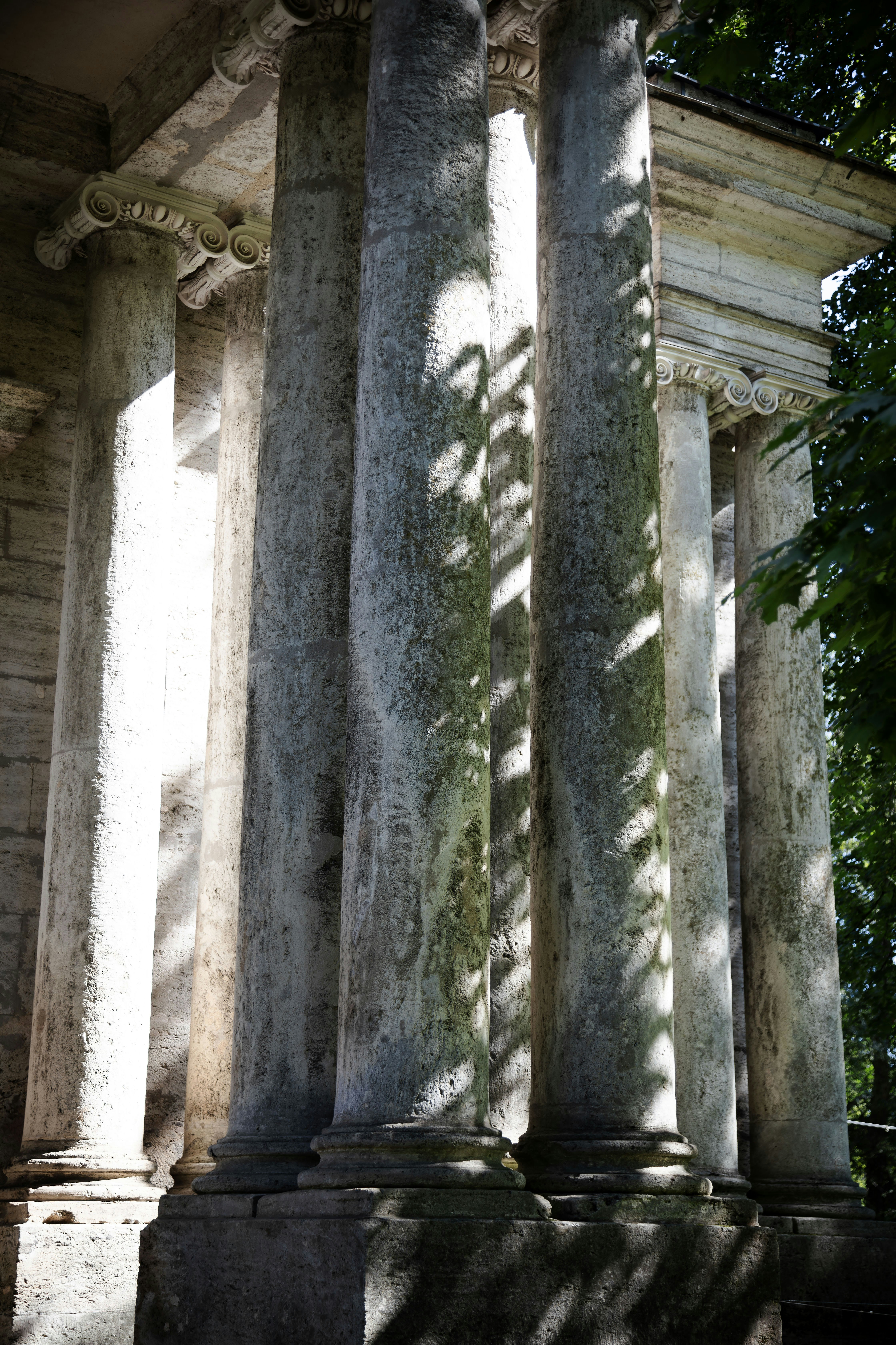 Stone columns with dappled sunlight and shadows photo – Free Russia ...