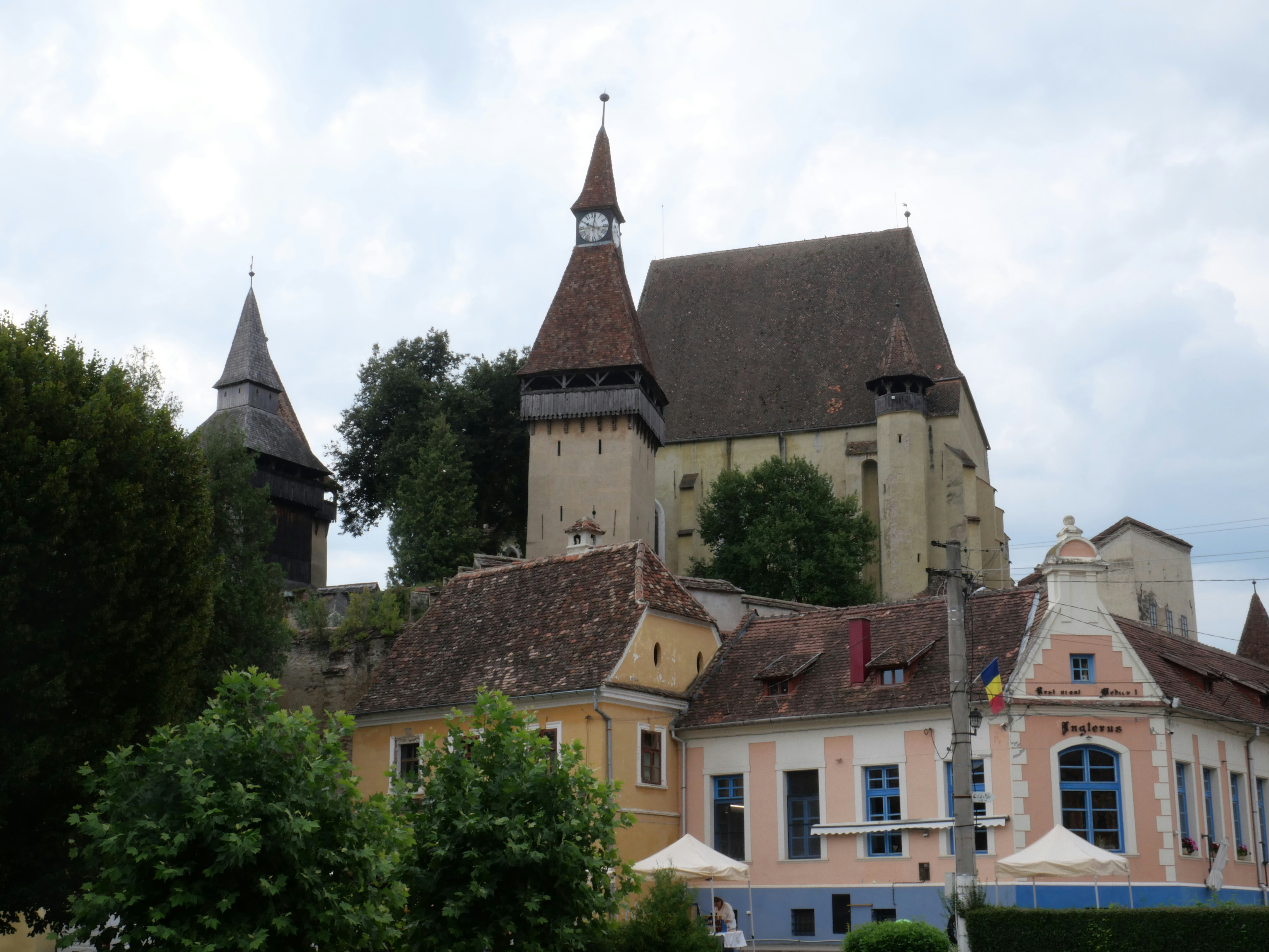 Medieval Towers Over a Sunlit Pastel Village