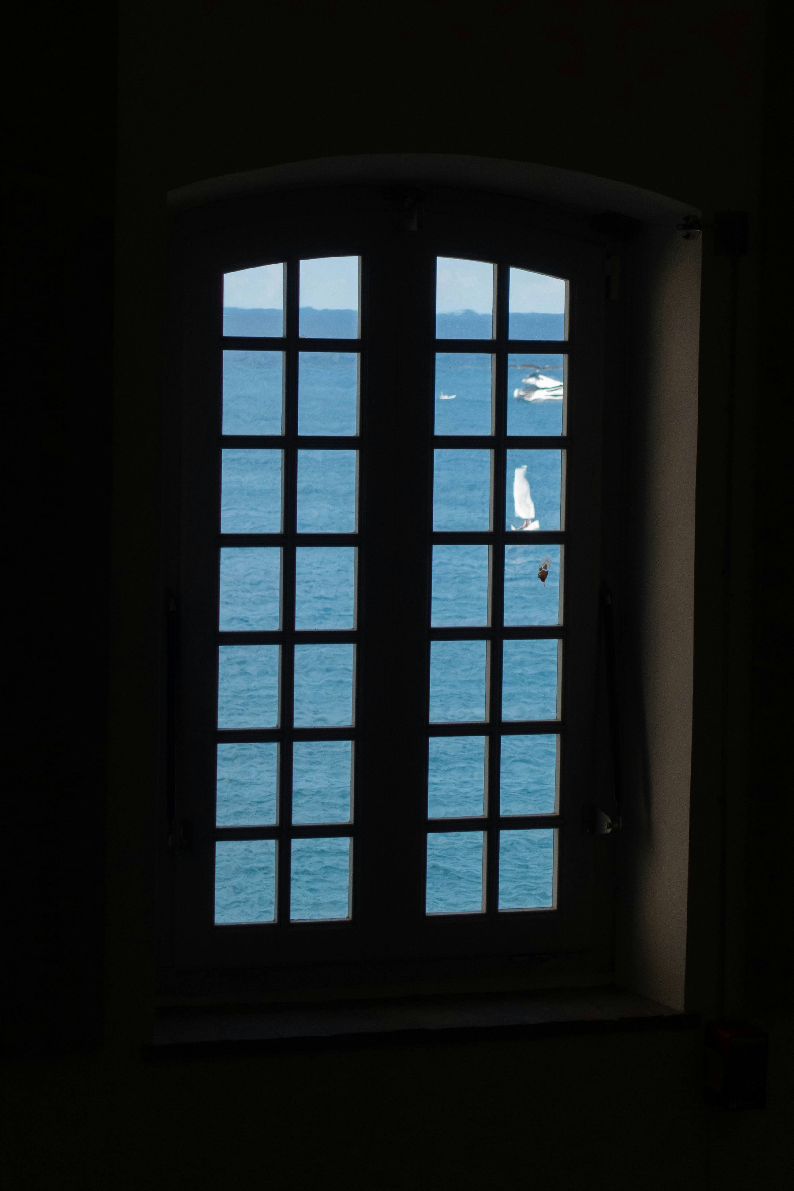 View of the sea through a window