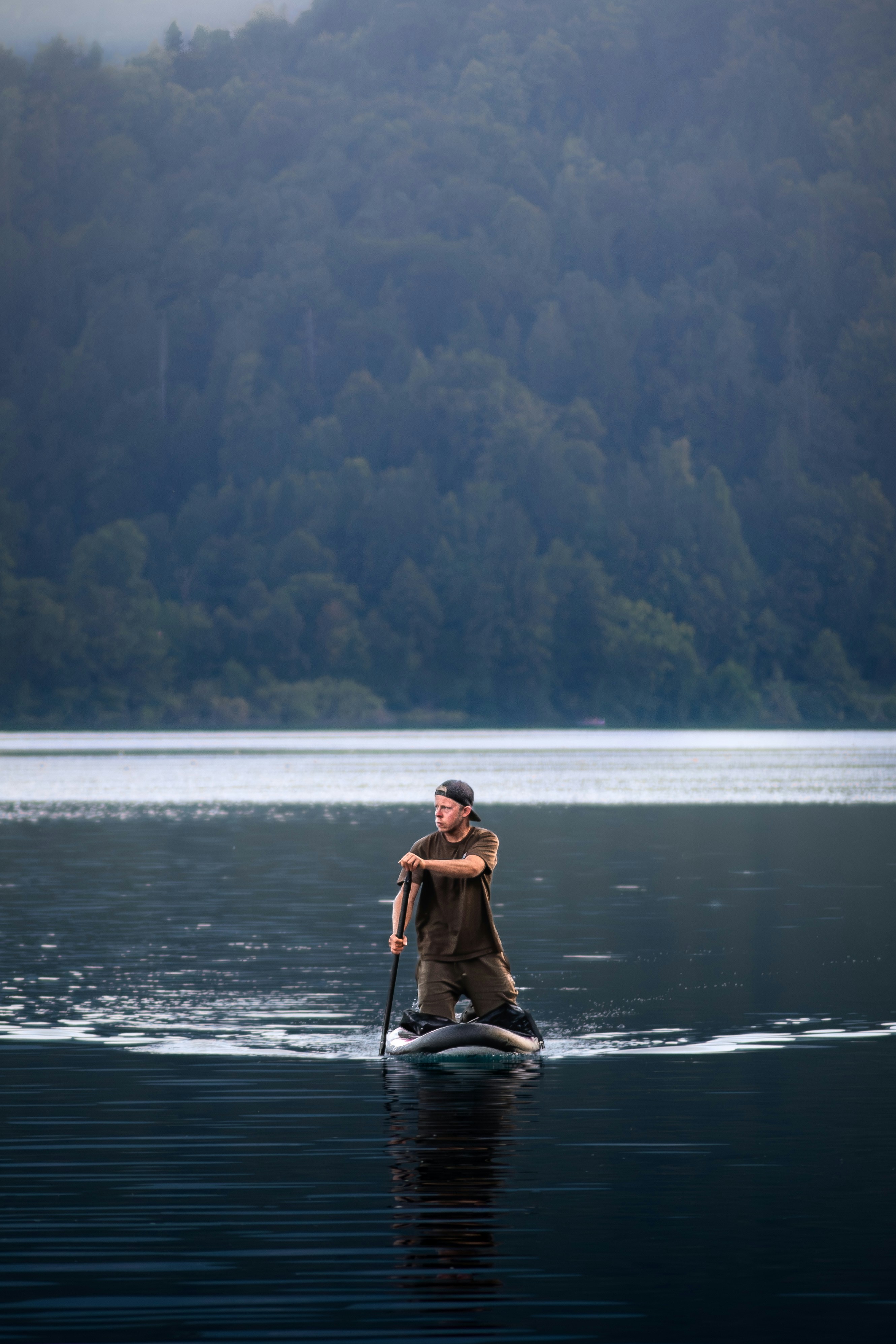 Paddleboarder in Tranquil Waters