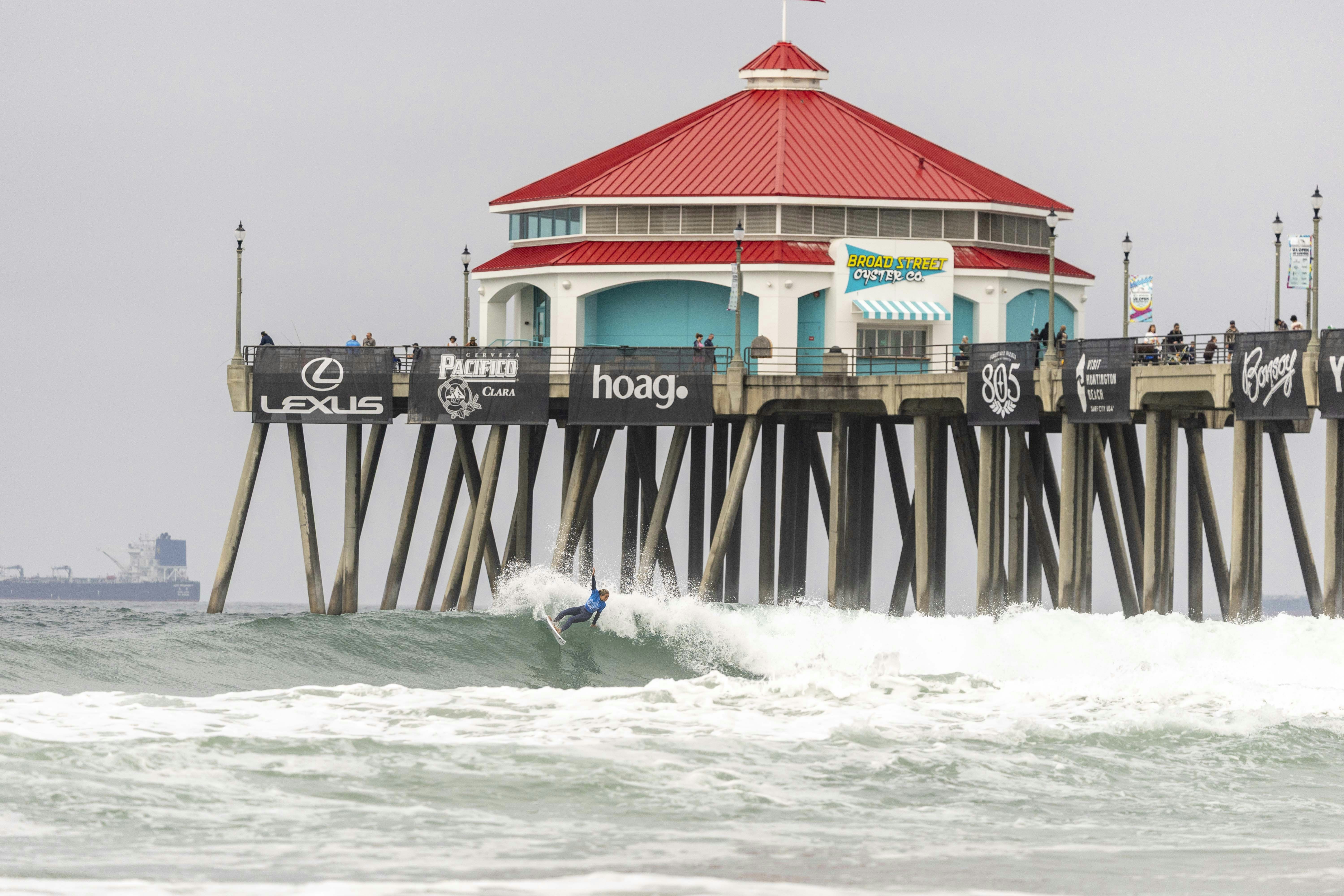 Red-roofed Piered Pavilion Overlooking Cresting Surf