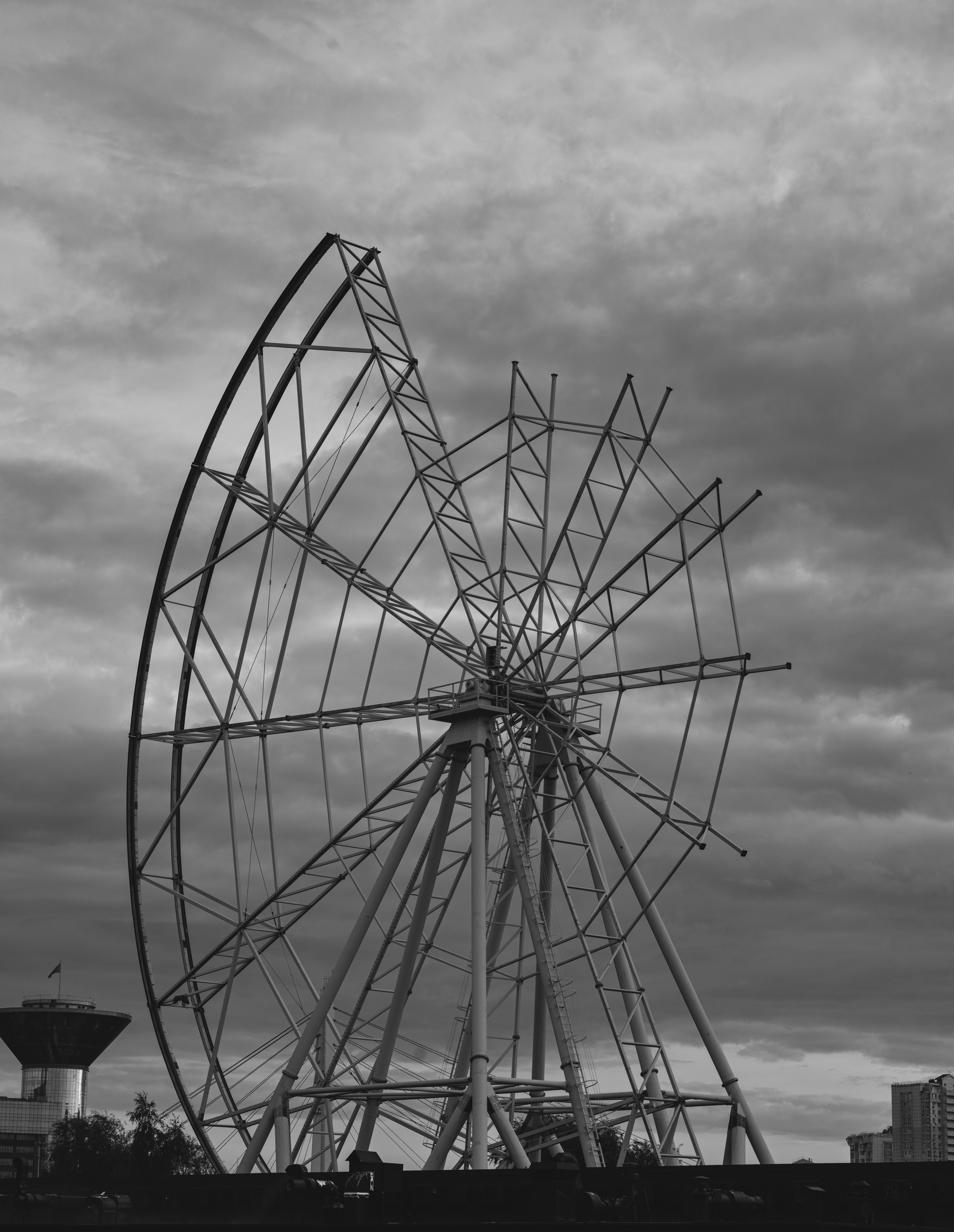 The Silent Giant: A Ferris Wheel's Steel Framework Against the Sky