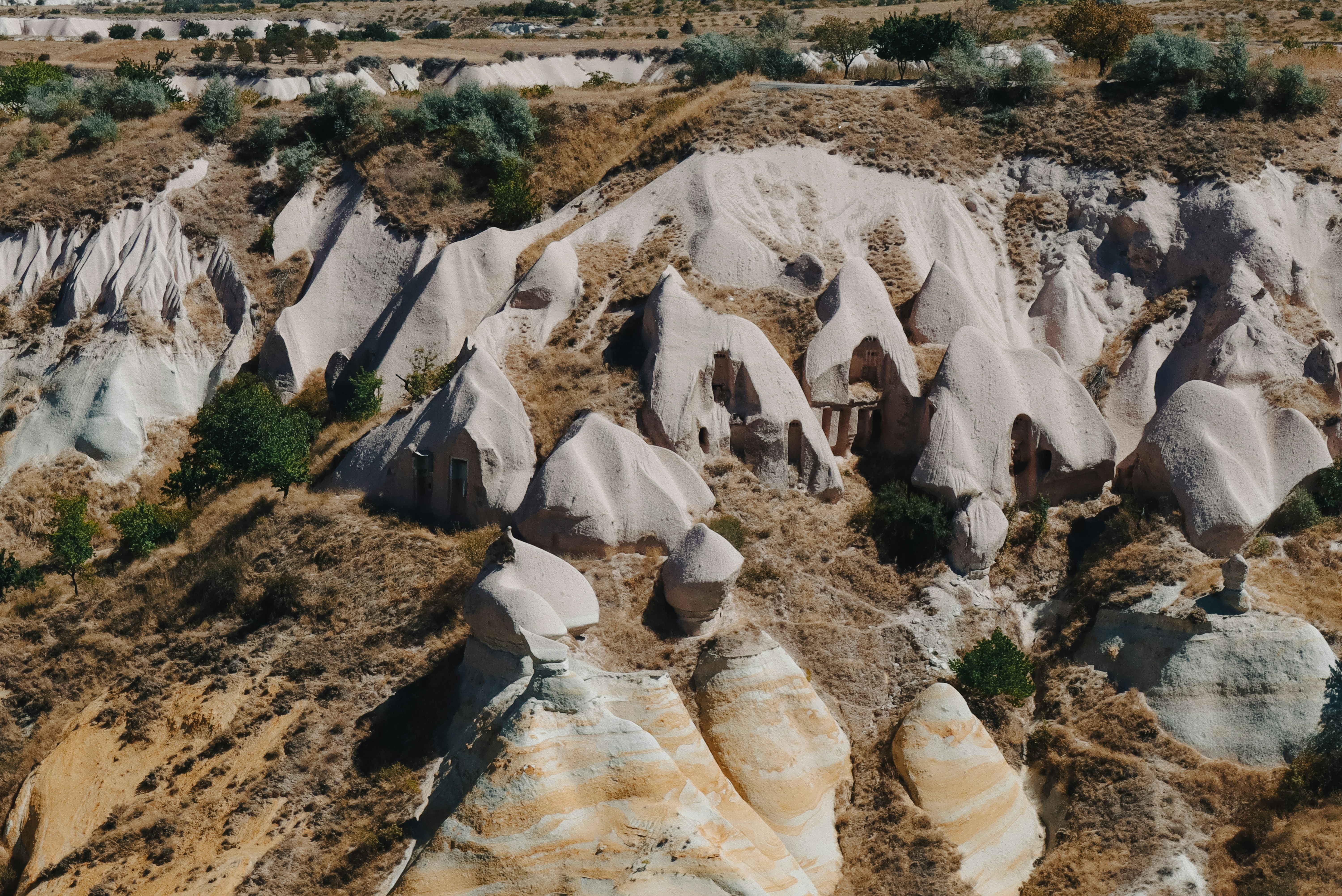 View of Pigeon Valley in Nevşehir | Eroded rock formations in a dry, arid landscape