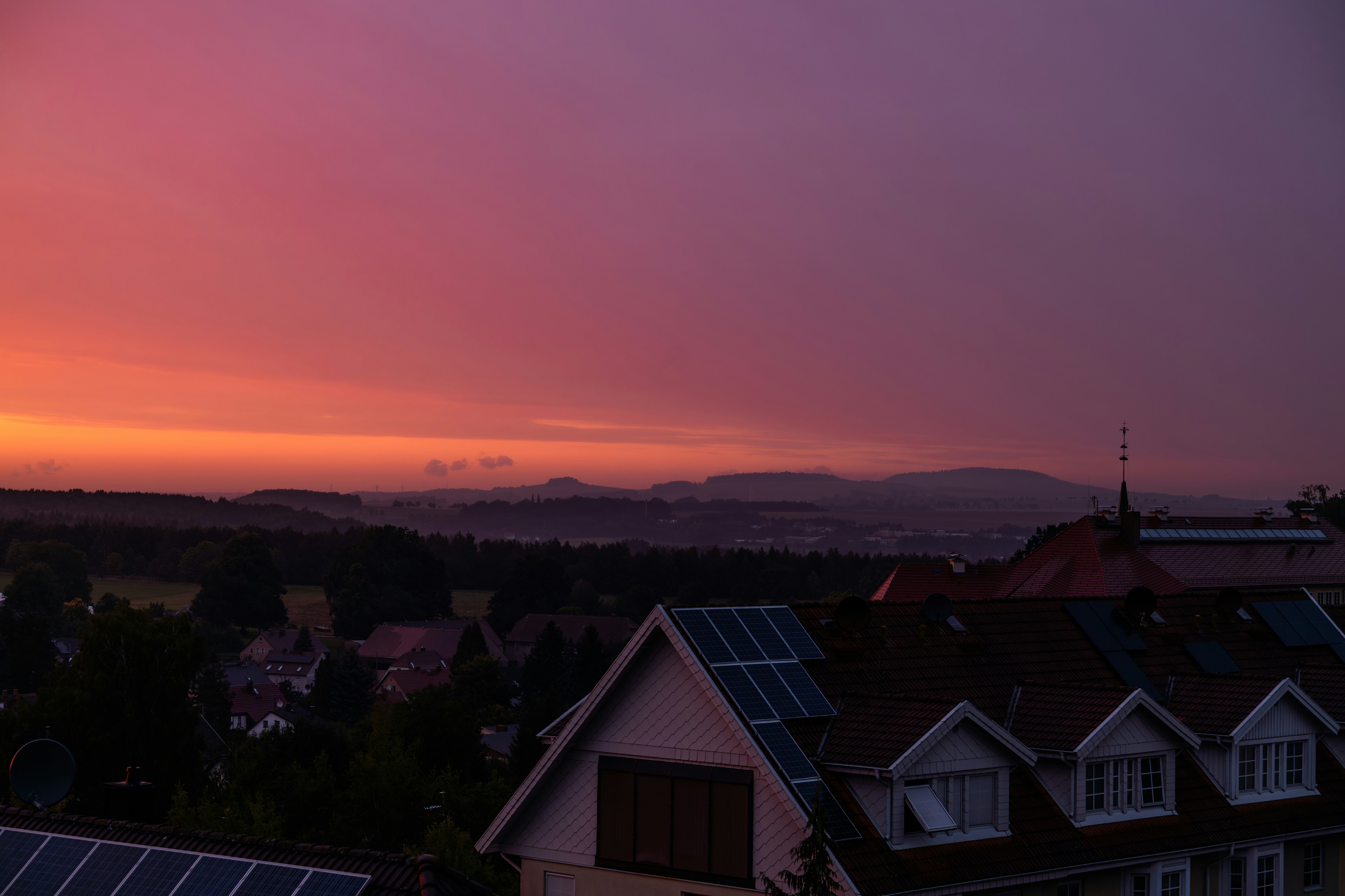 Vibrant sunset over a distant mountain range
