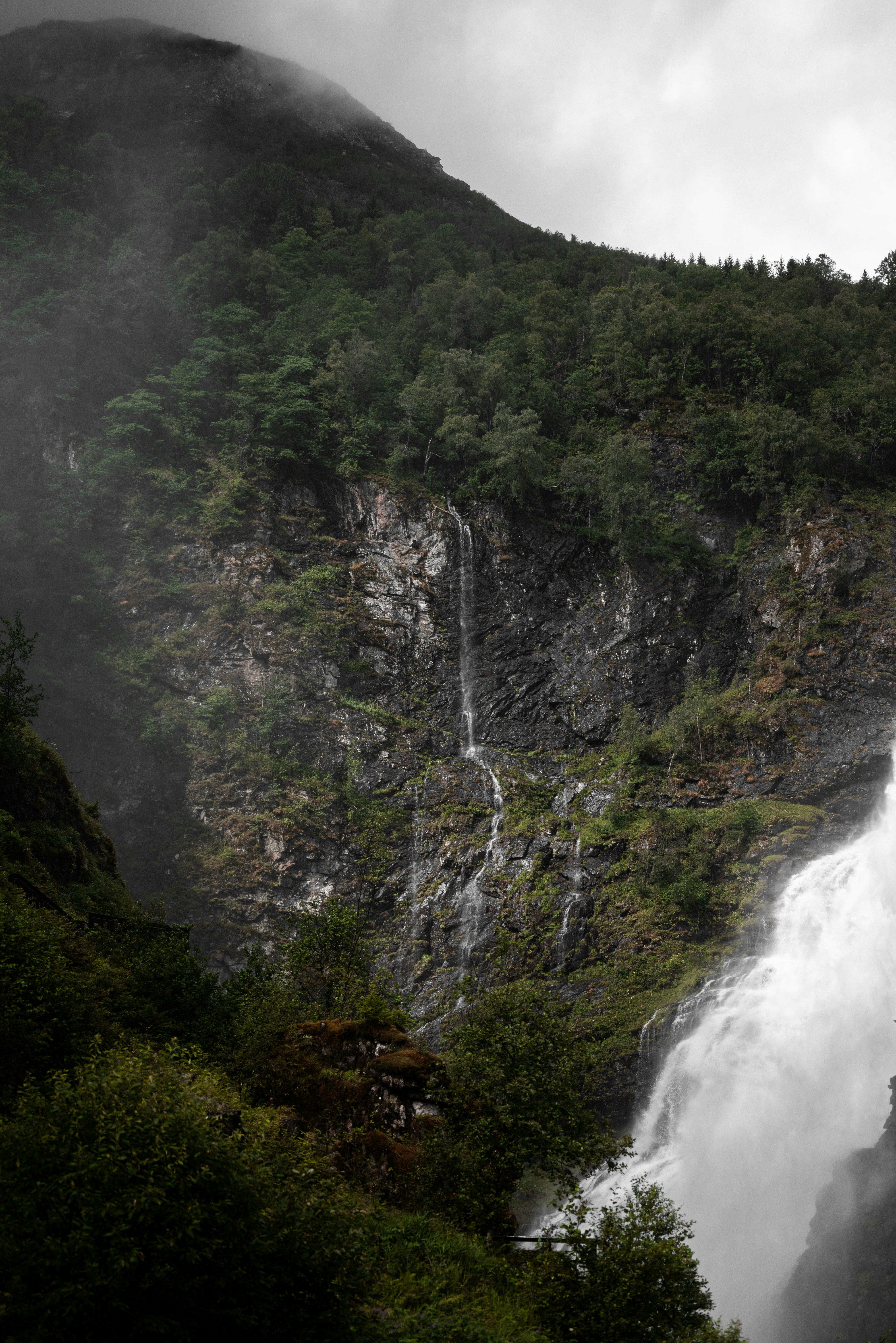 Misty mountain with a cascading waterfall