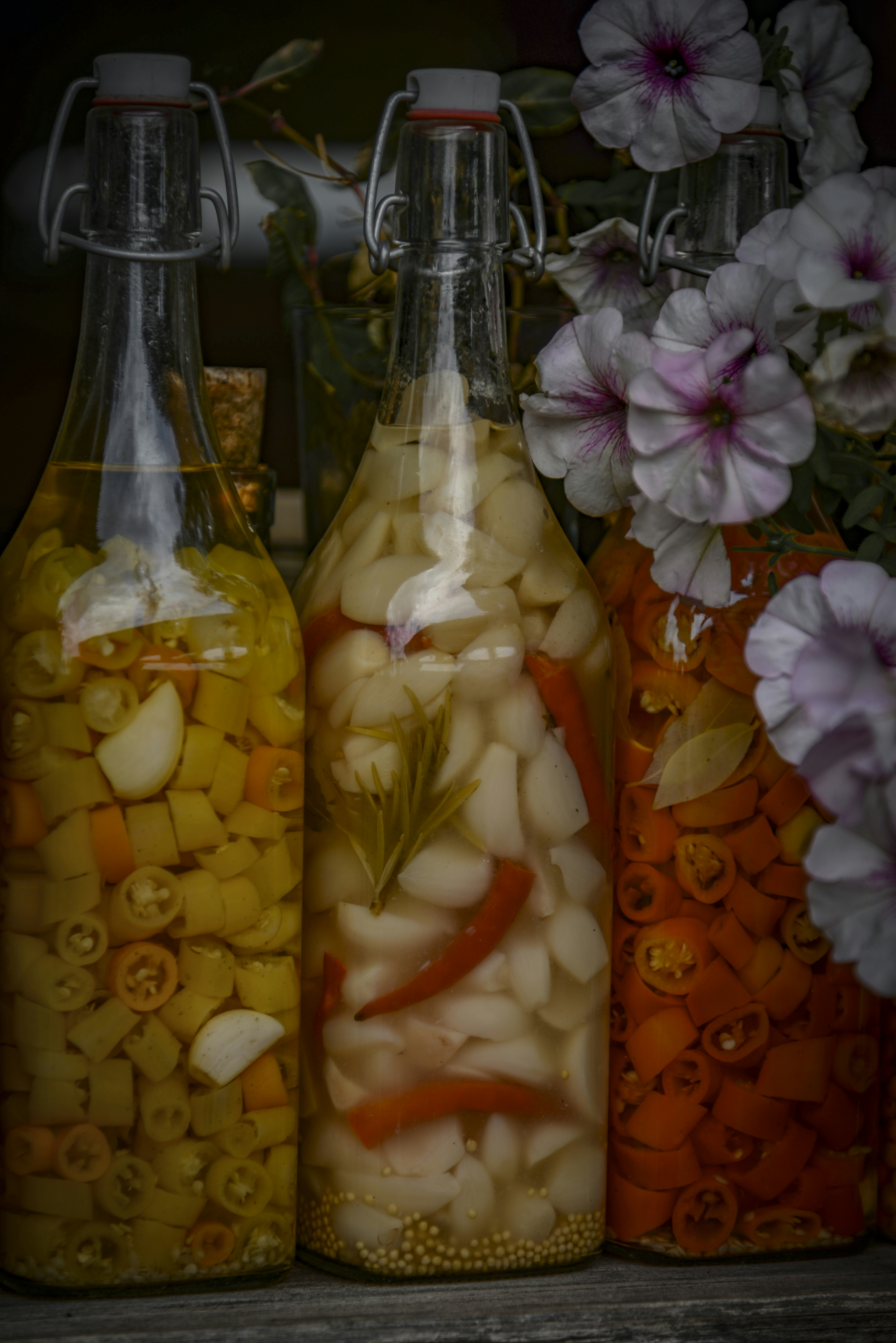 Amber Pantry Portrait: Pickled Jars Framed by Soft Petunias