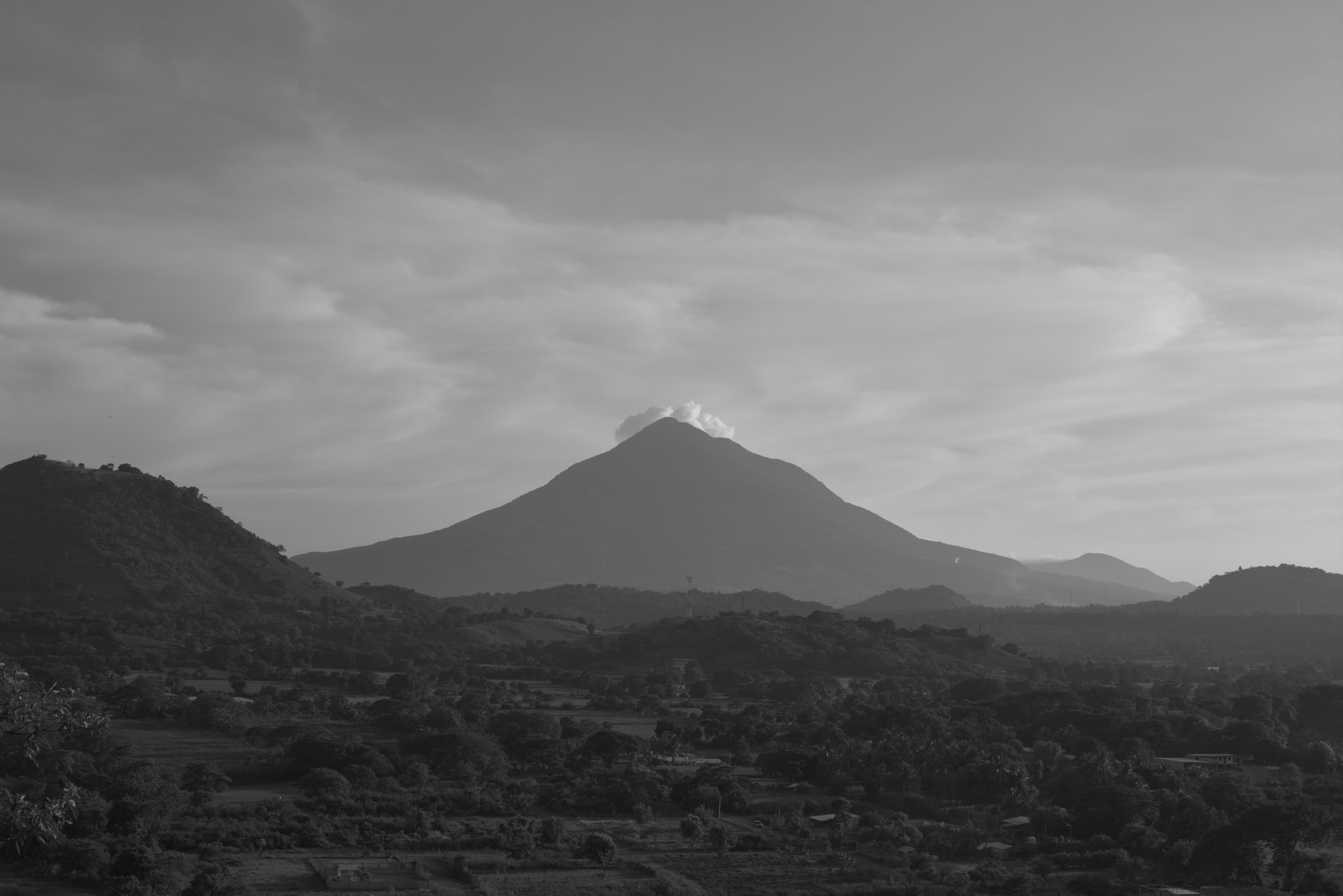 Dramatic mountain peak against stormy sky