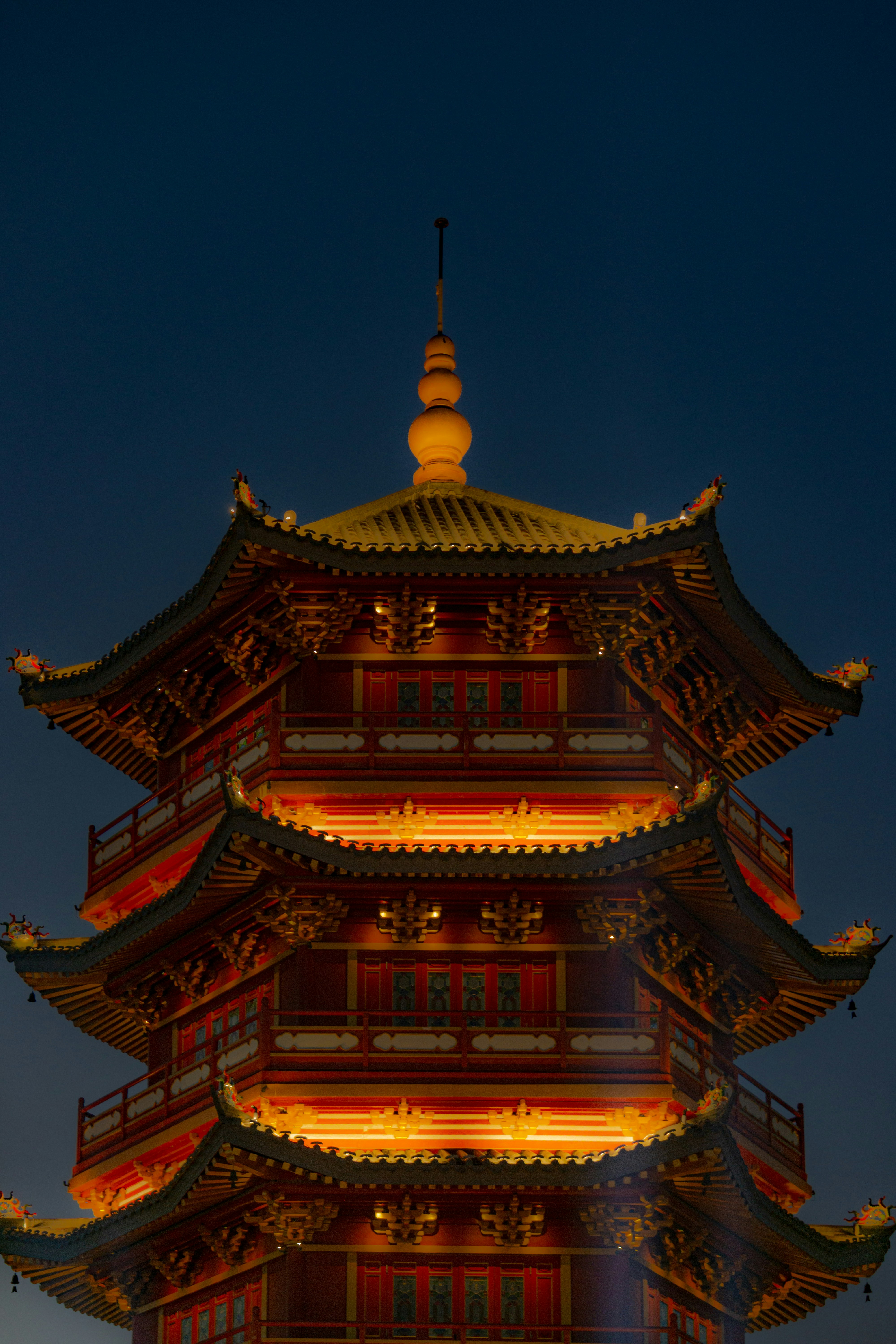 Traditional east asian pagoda illuminated at night