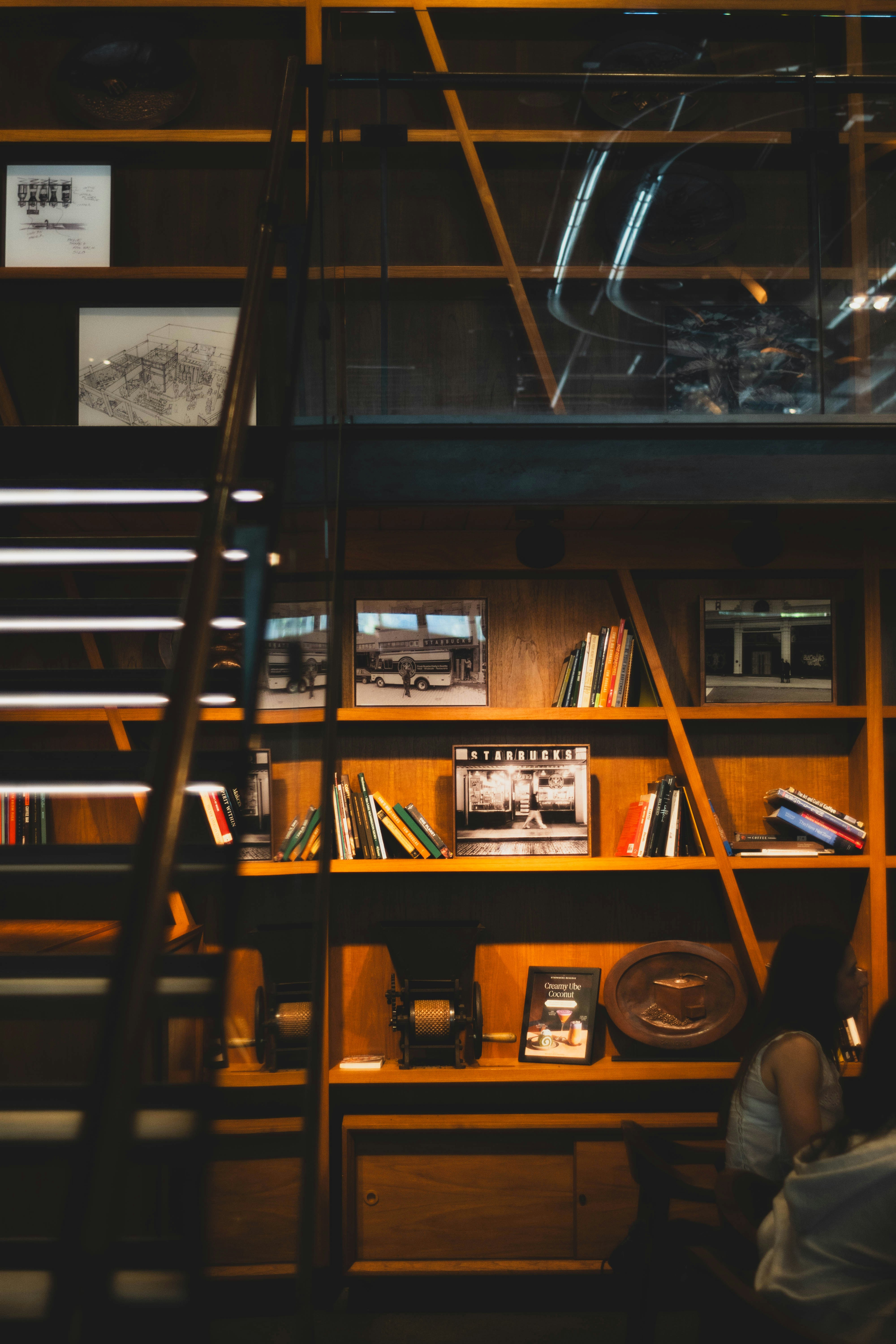 Bookshelves filled with books and decor in a cozy room.