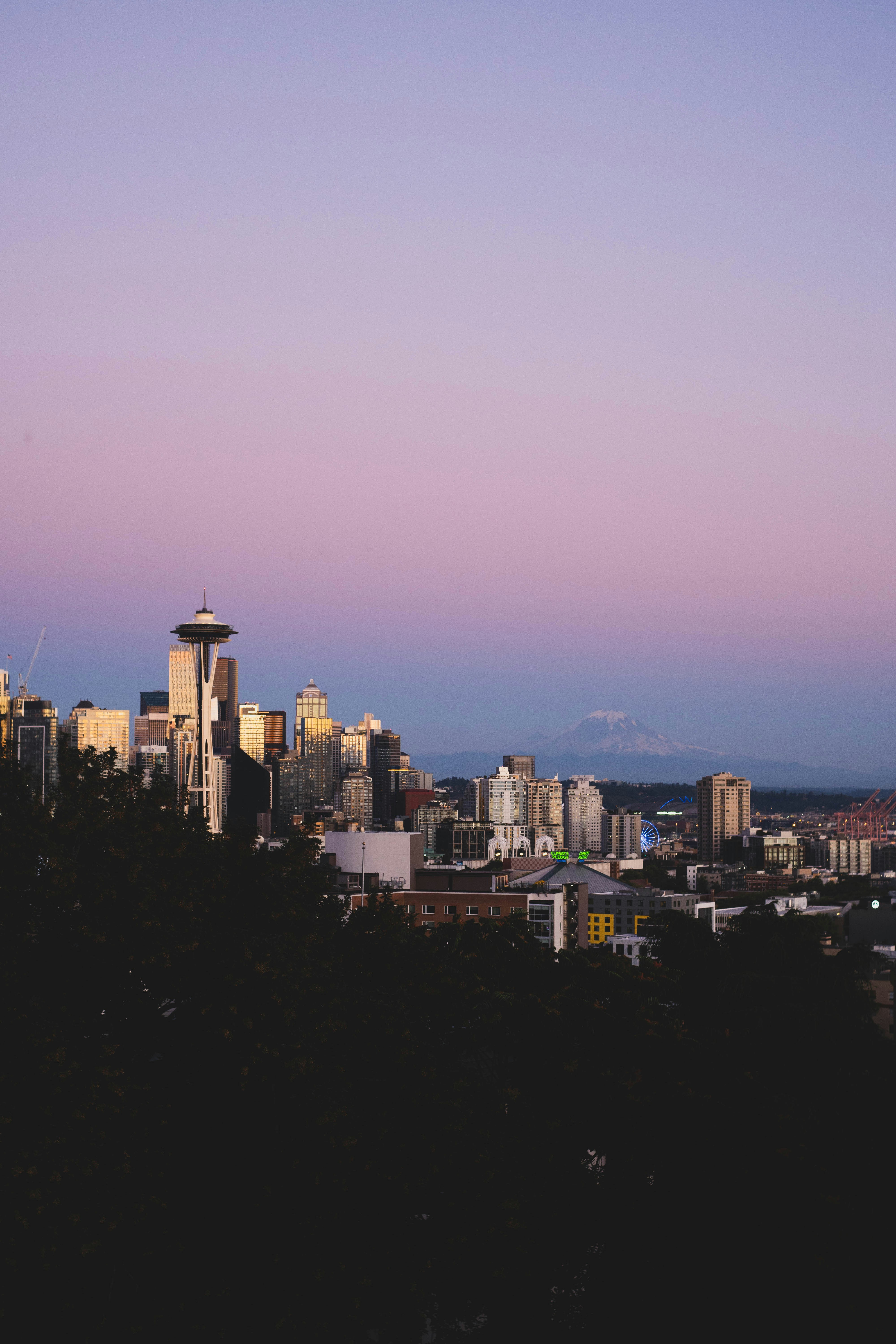 City skyline at dusk with purple sky