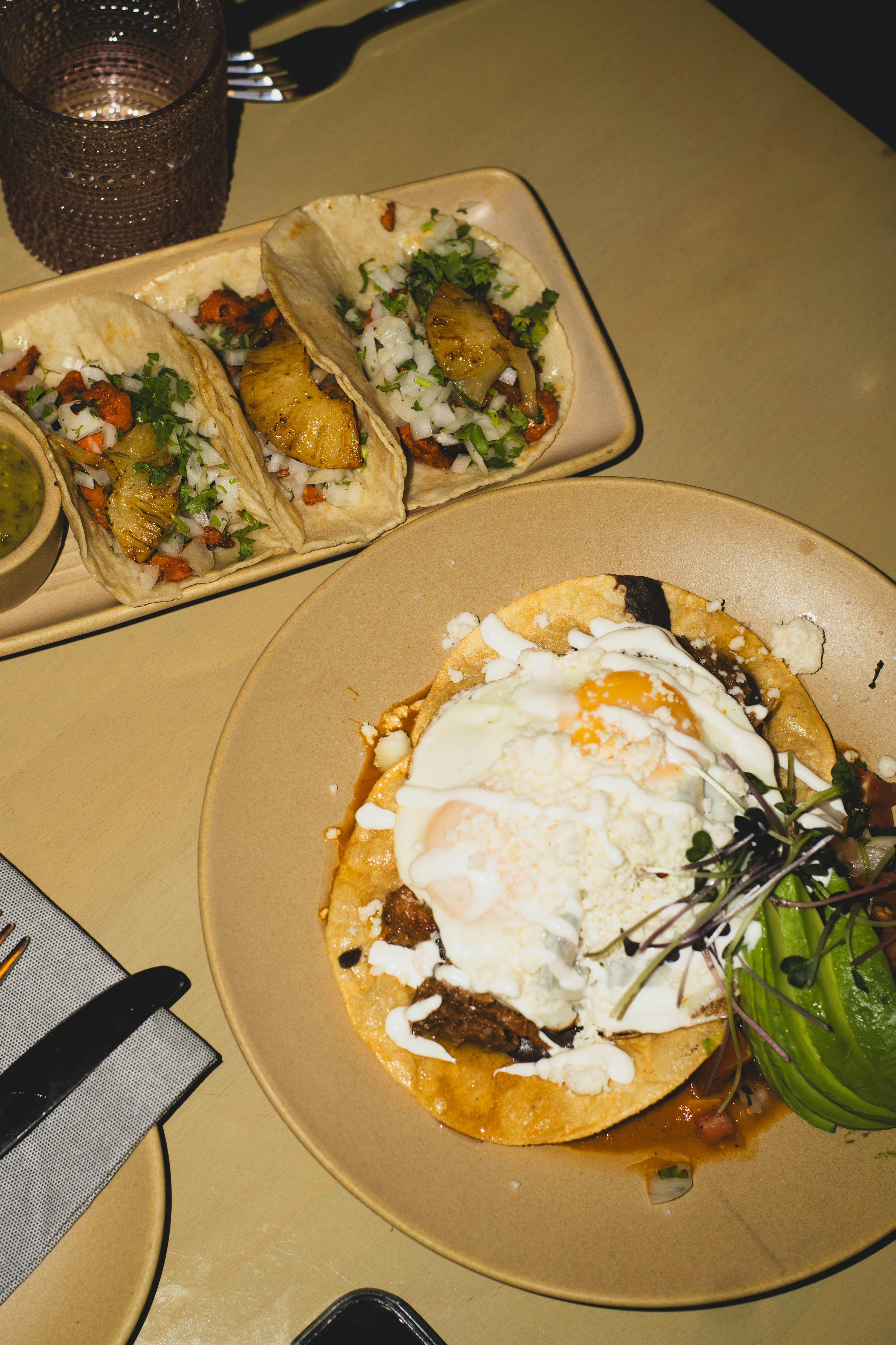 Egg-Crowned Tostada Meets Taco Trio on a Warm Table