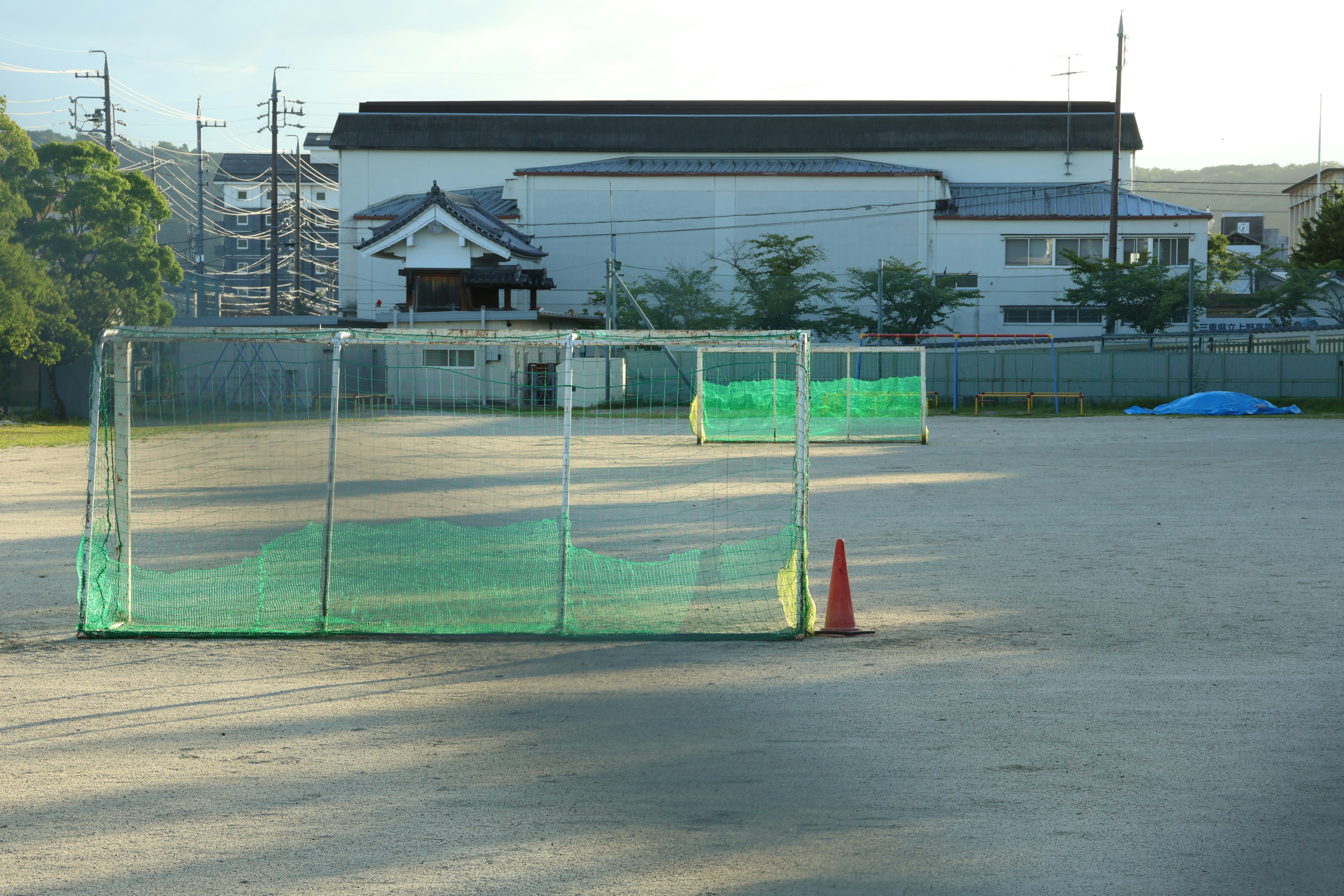 Empty soccer field with goalposts and cones