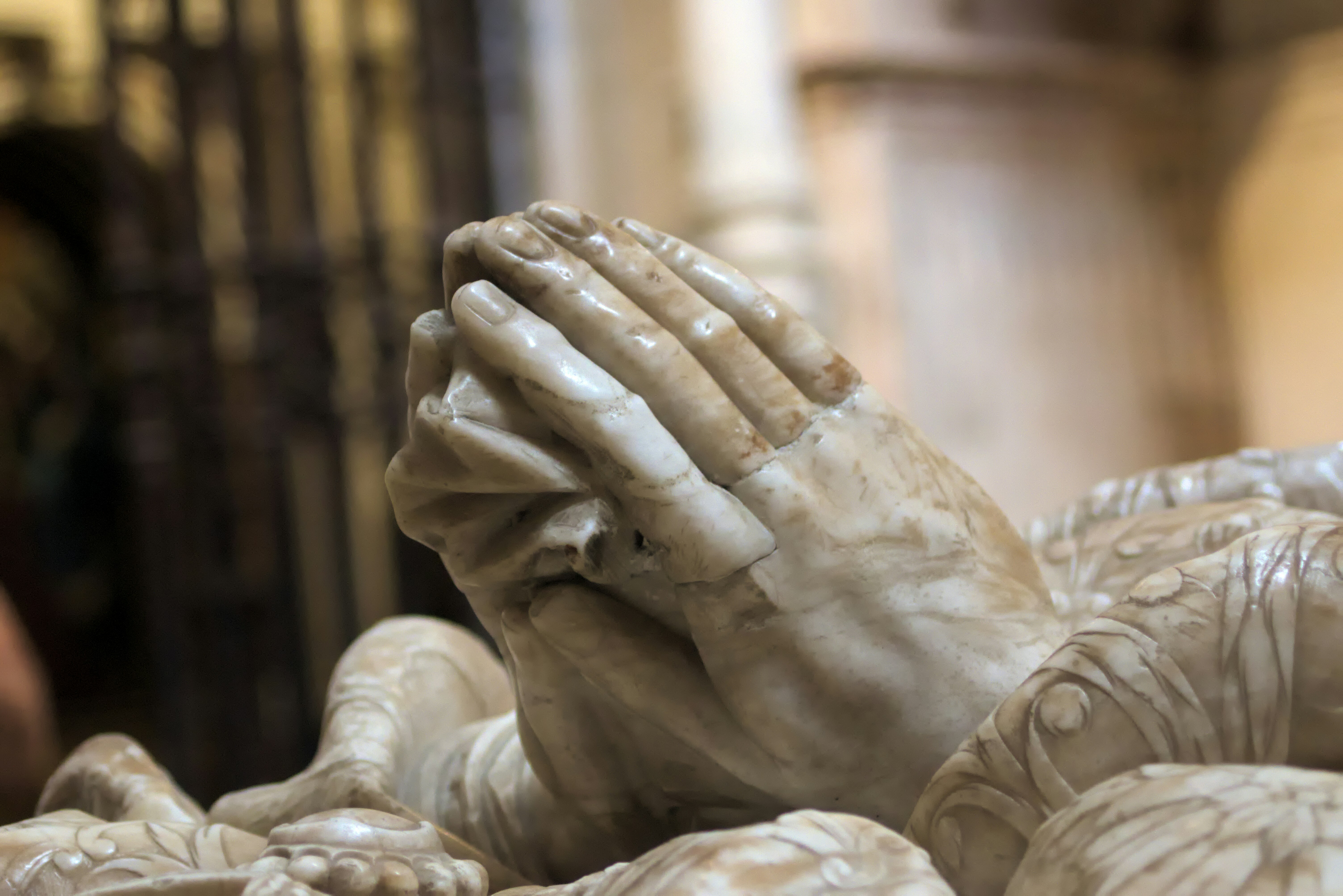 Burgos is a very important city in the Noth of Spain. In Castilla -Leon. Its cathedral is probably the most important building in city. And the most important gothic building in Spain | Stone hands clasped in prayer on a tomb.