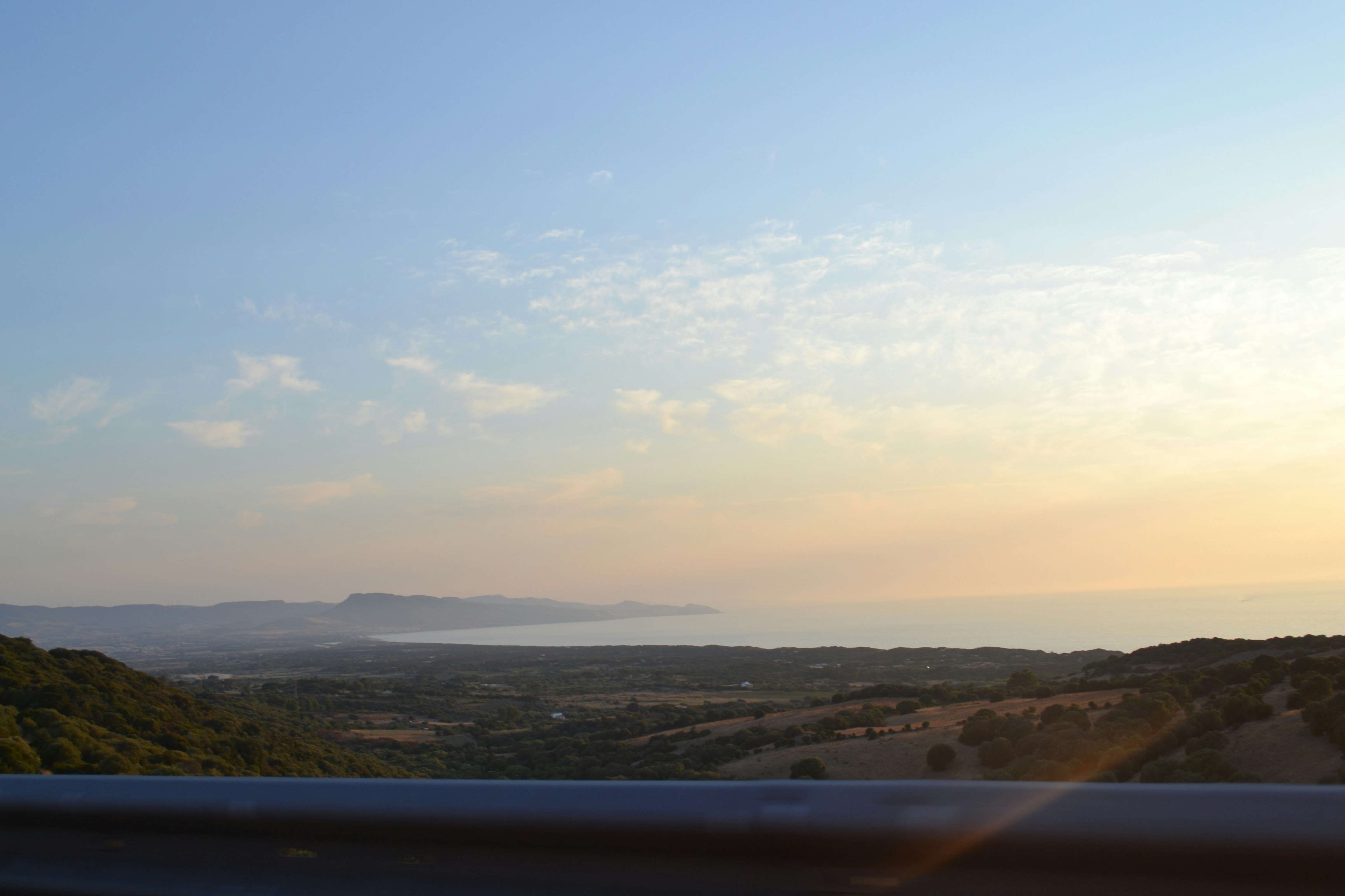 Hills overlooking the ocean at sunset