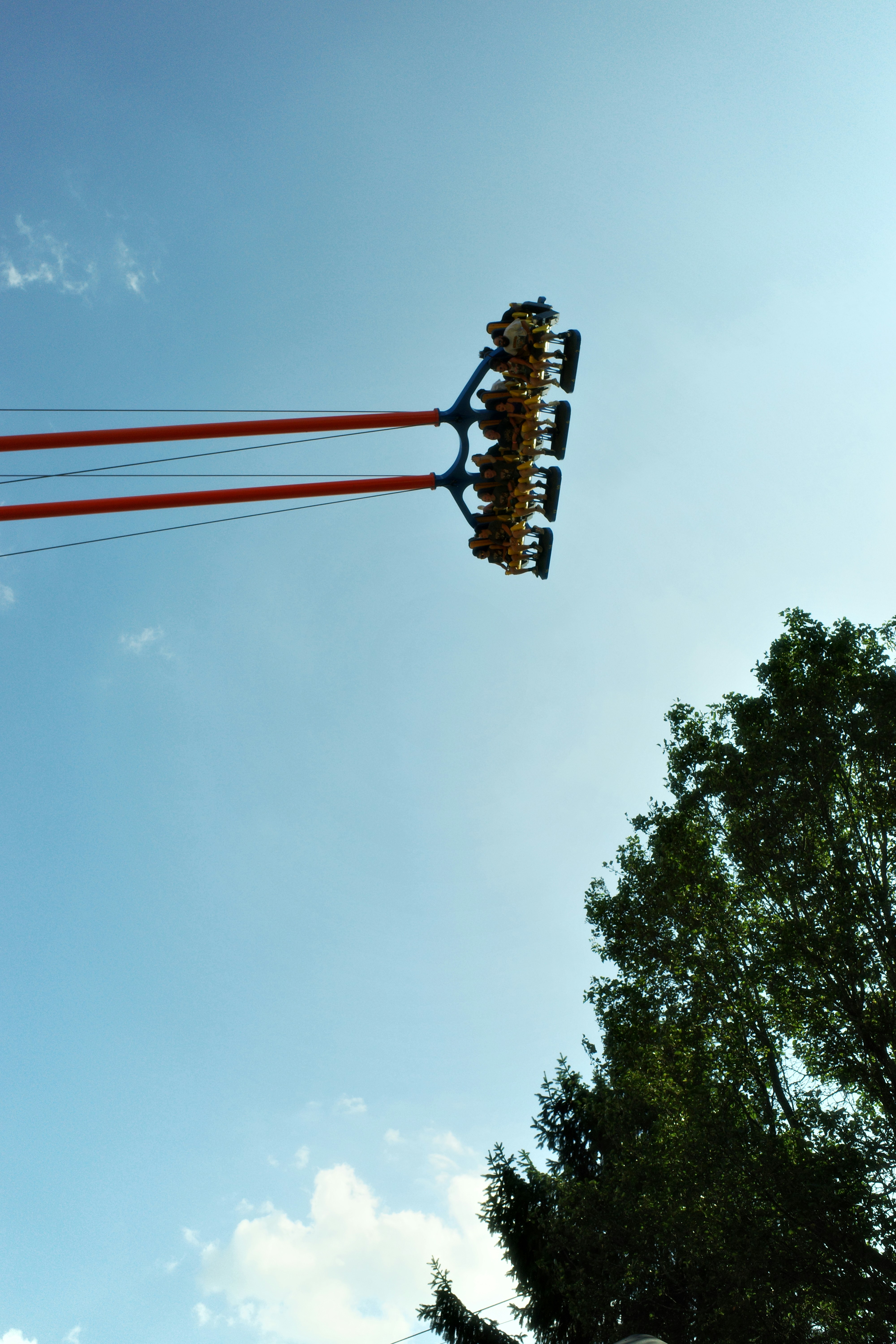 Amusement park ride against a clear blue sky