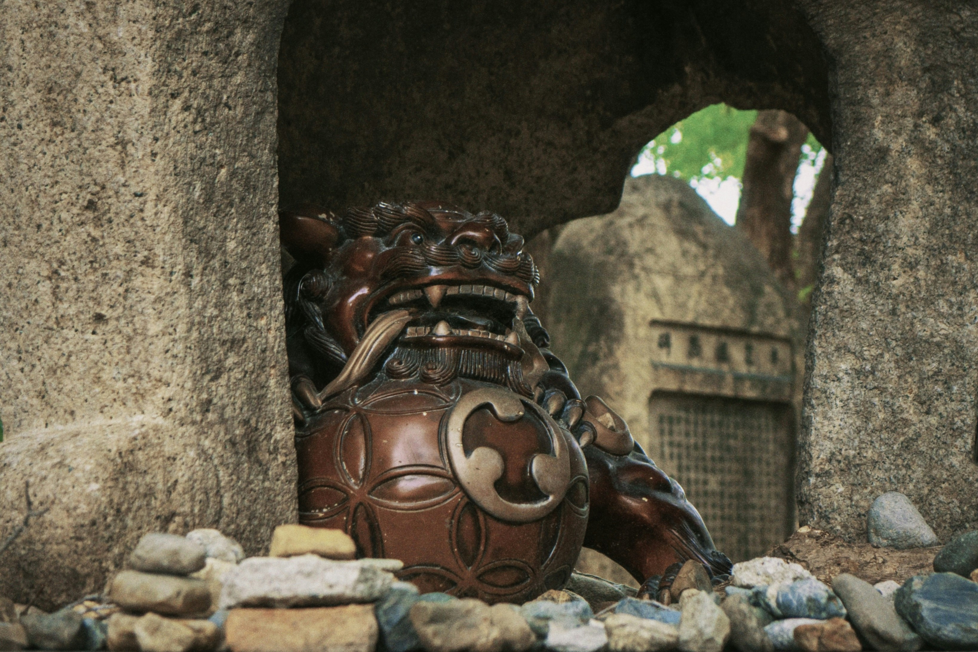 Ancient stone carving with a circular symbol