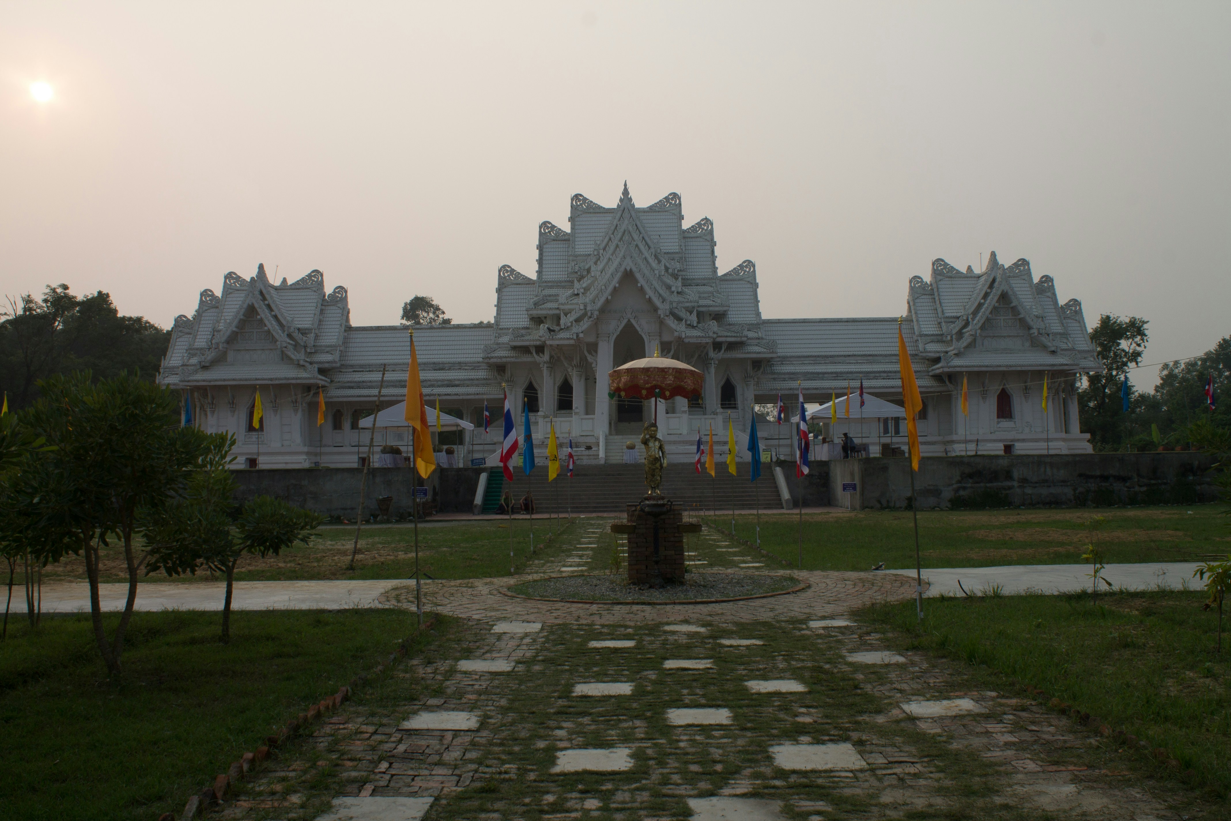 Royal Thai Buddhist Monastery at Lumbini | Ornate building with intricate architectural details and garden