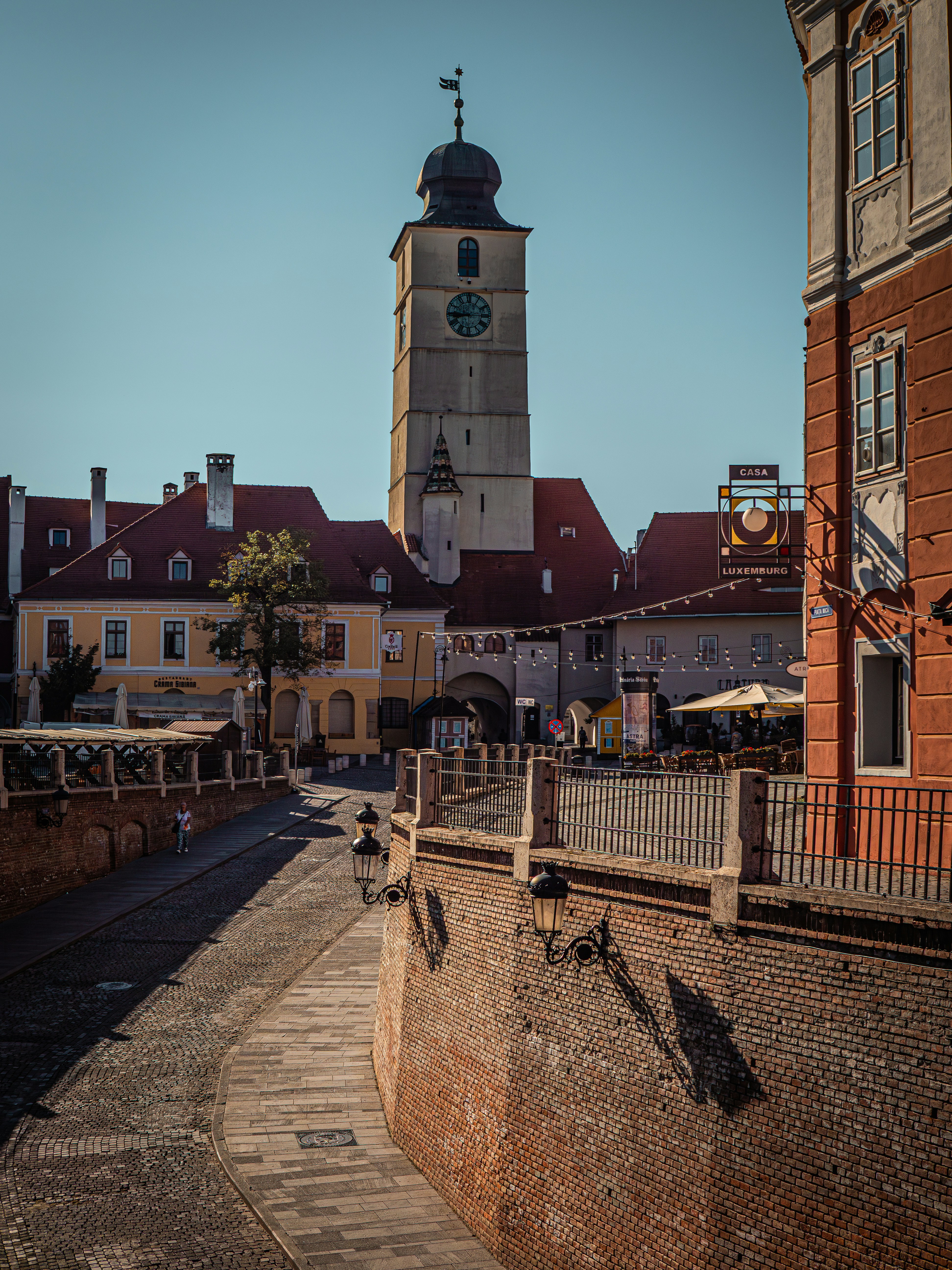 Historic town square with a tall clock tower.