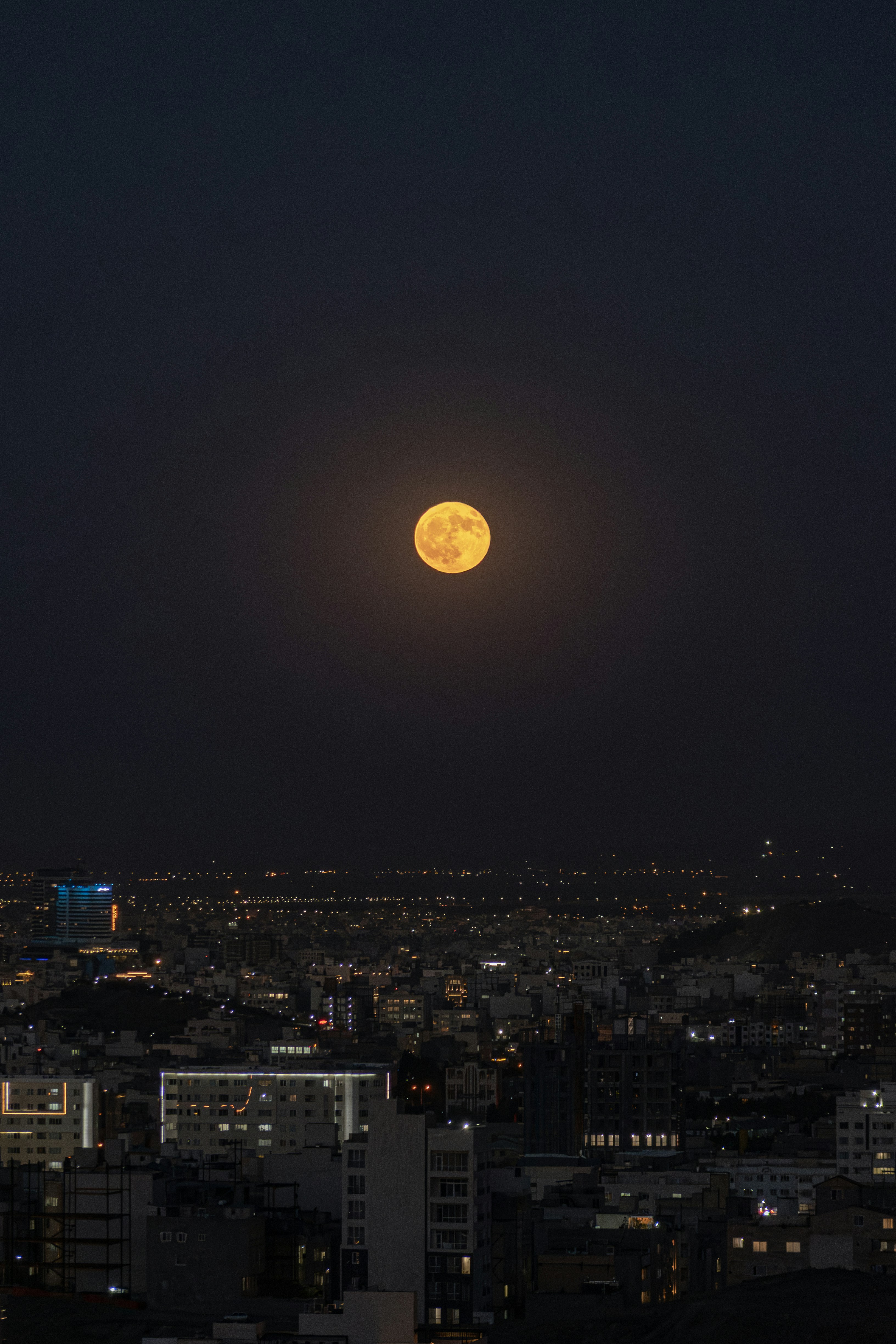 Lunar Glow Over Urban Landscape