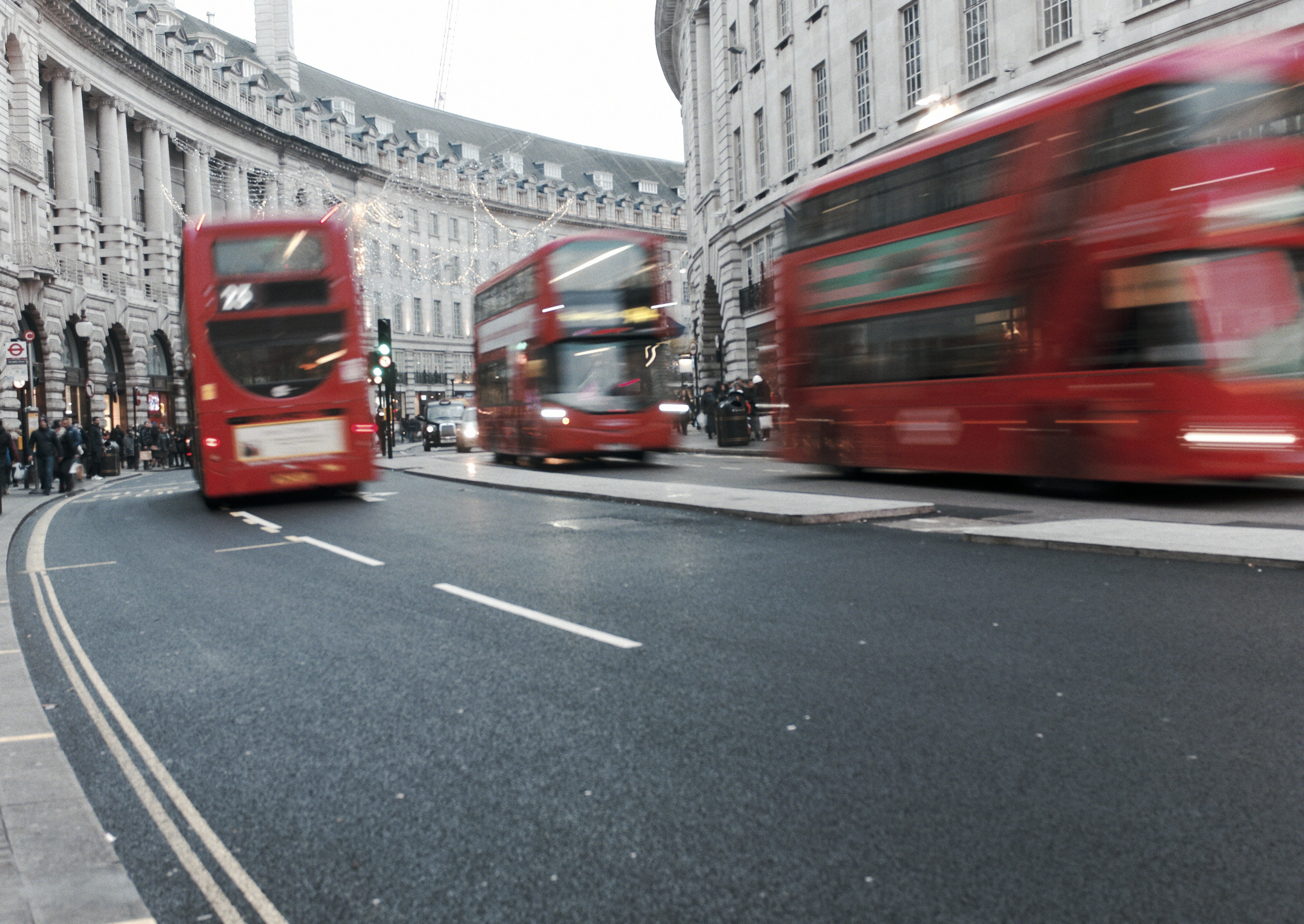 Red double-decker buses on a city street
