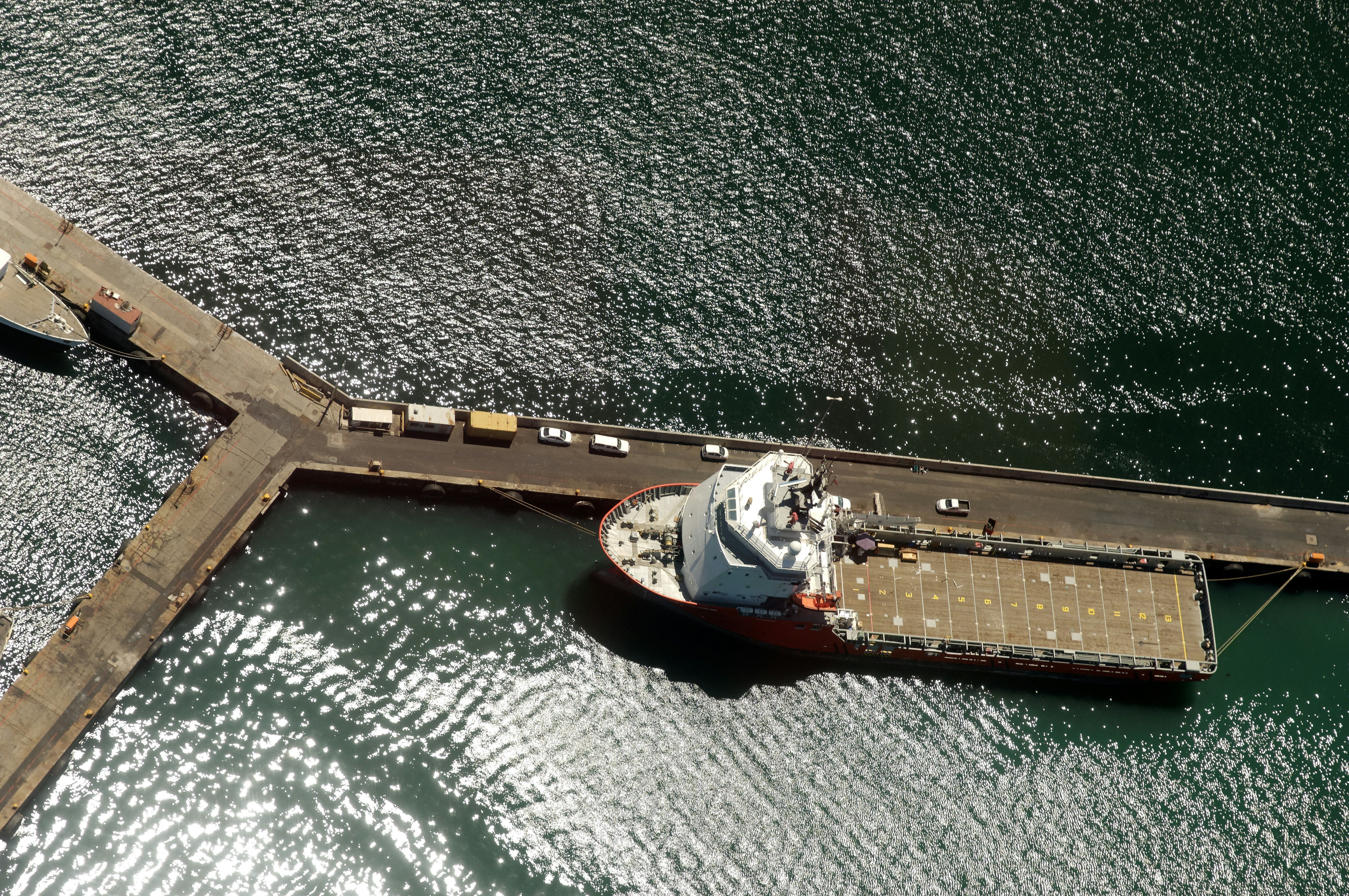 Wooden planks on a dark, rippling surface