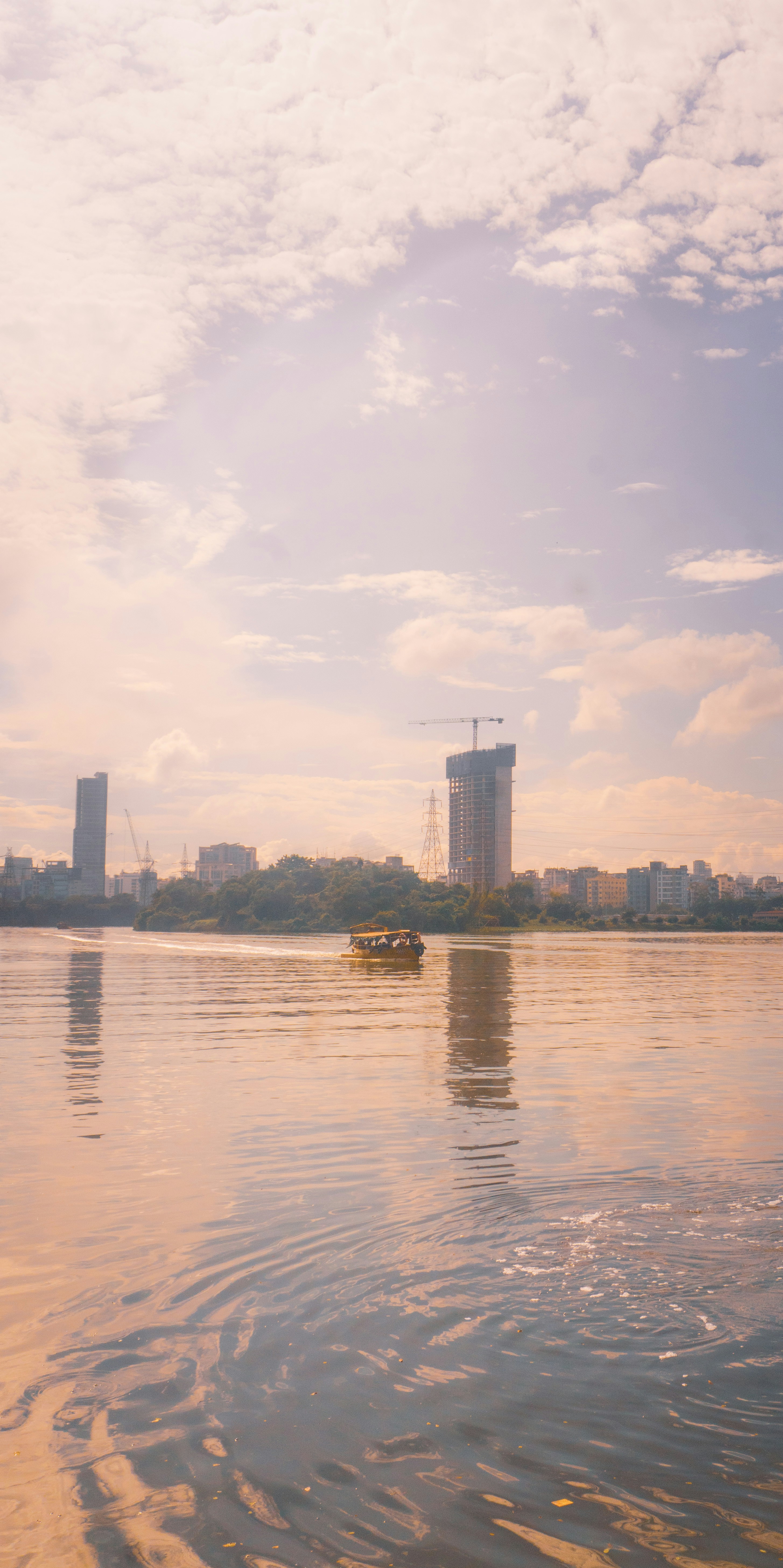 Boating on a calm lake with city skyline background