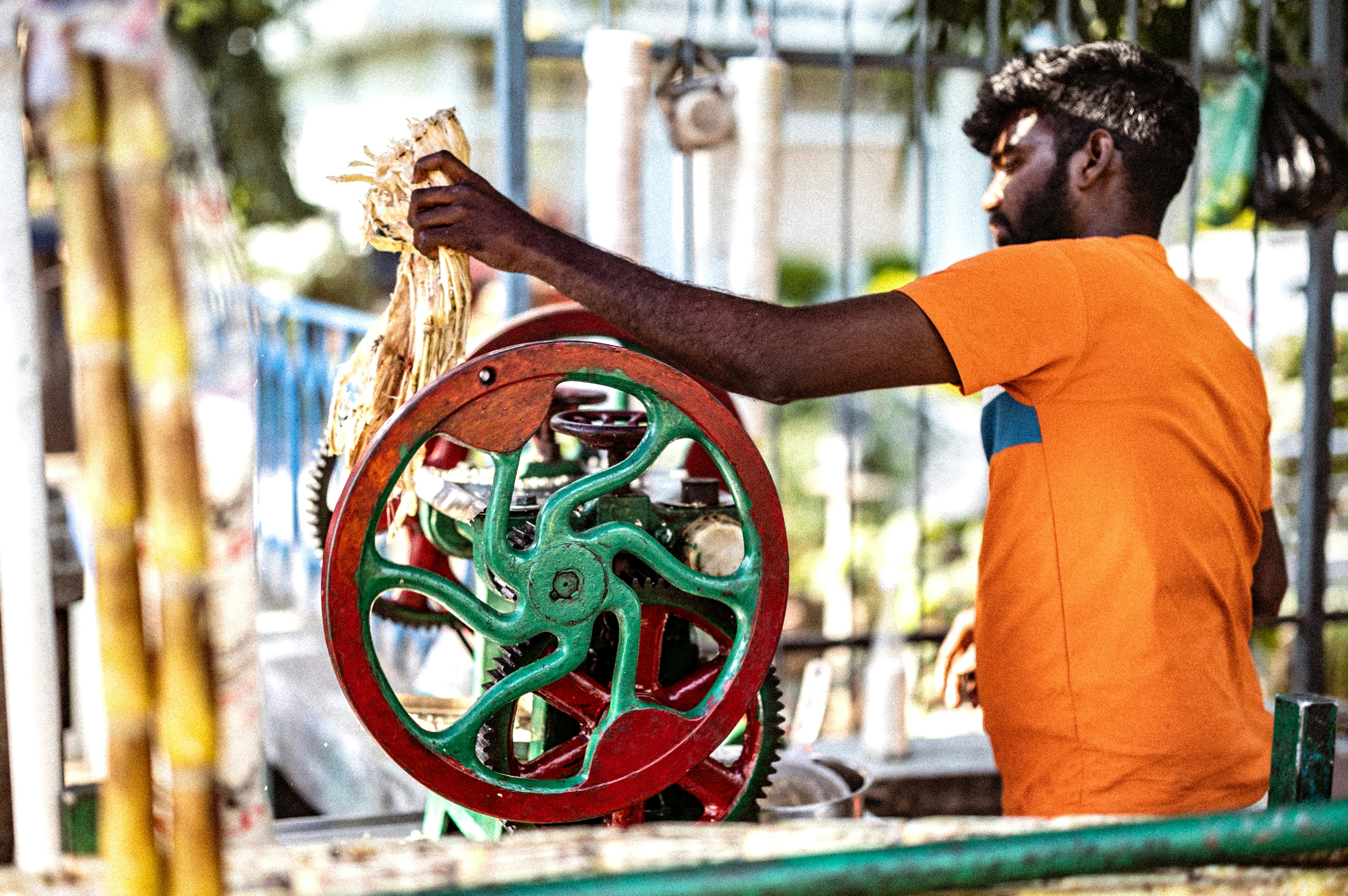 "Refreshing" | Man operating a sugarcane juice machine