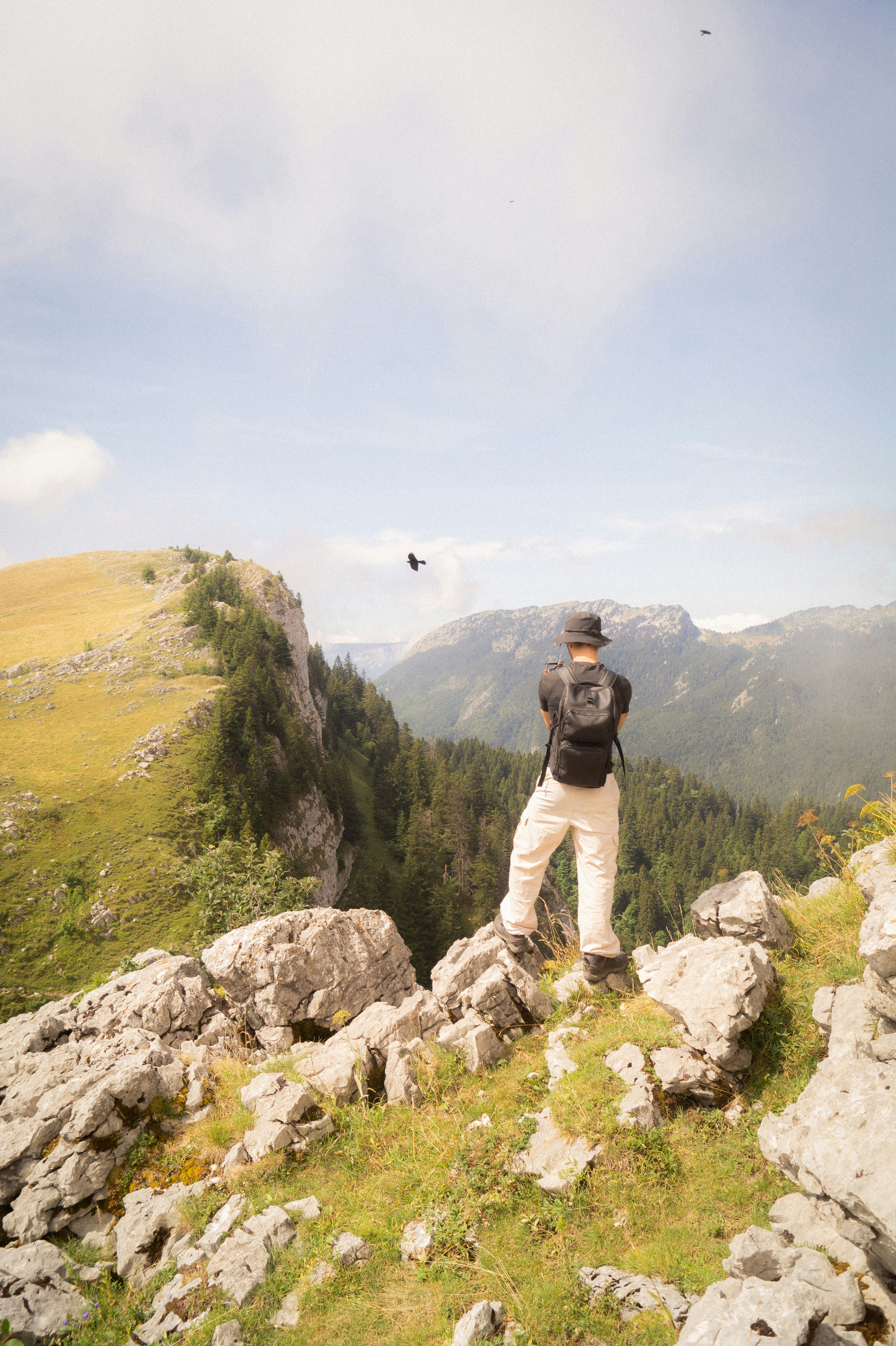 Hiker with backpack on mountain overlook